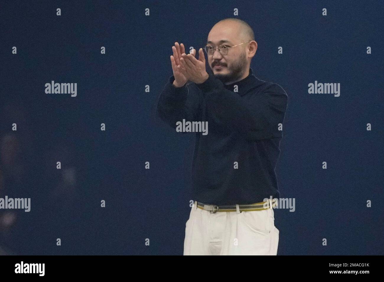Designer Satoshi Kondo acknowledges applause at the end of the Issey ...