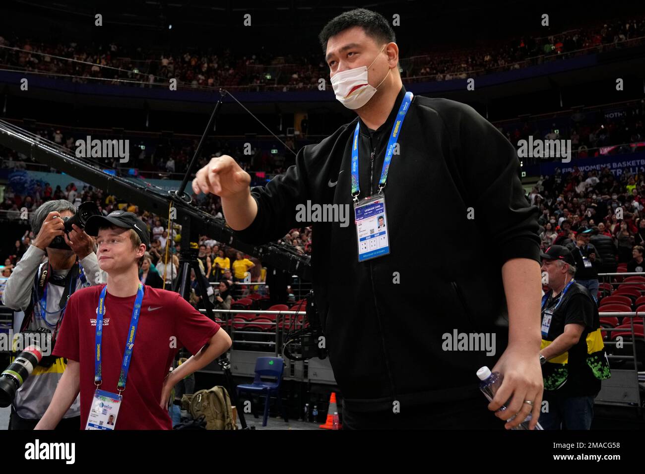 Former NBA star Yao Ming, right, watches China's players celebrate ...