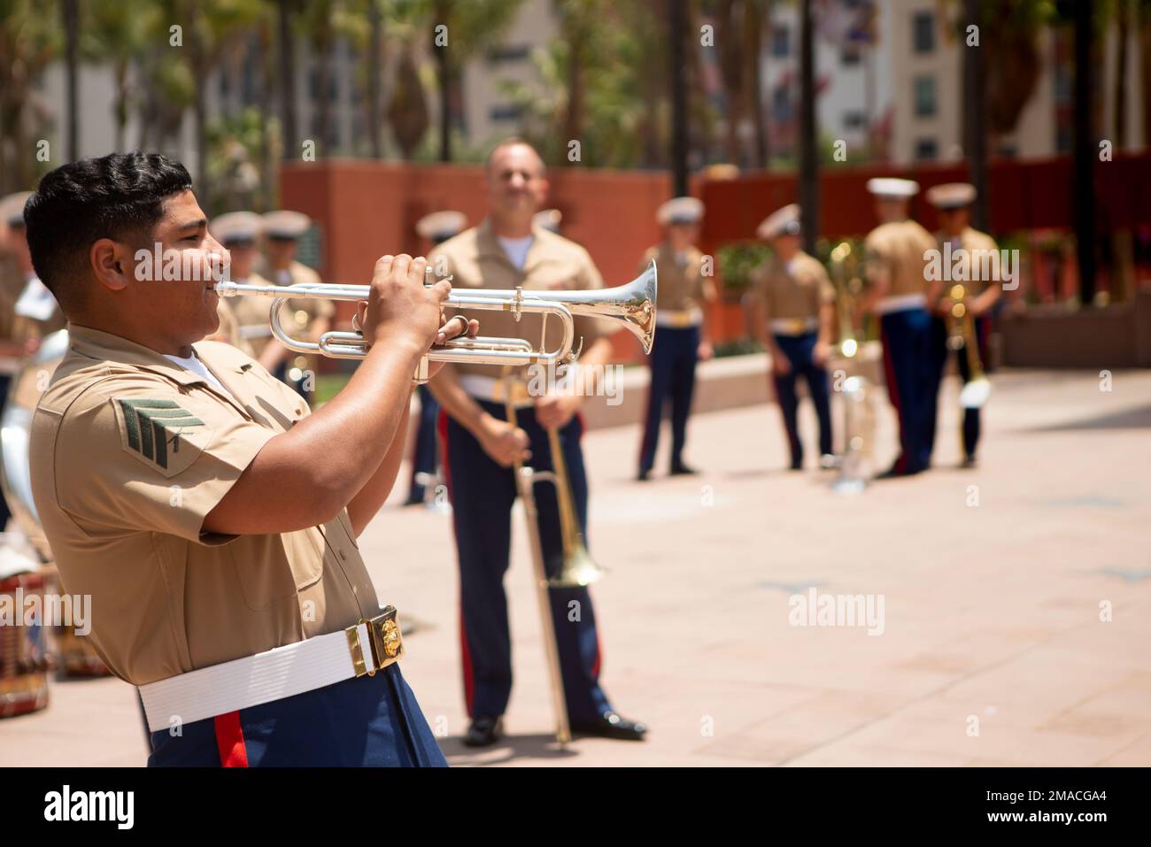 U.S. Marine Corps Sgt. Christian Rosario, a trumpet player assigned to ...