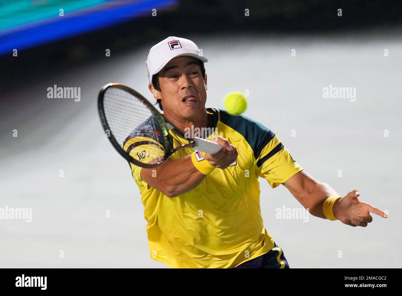 Mackenzie McDonald of the United States returns a shout to Aleksandar ...