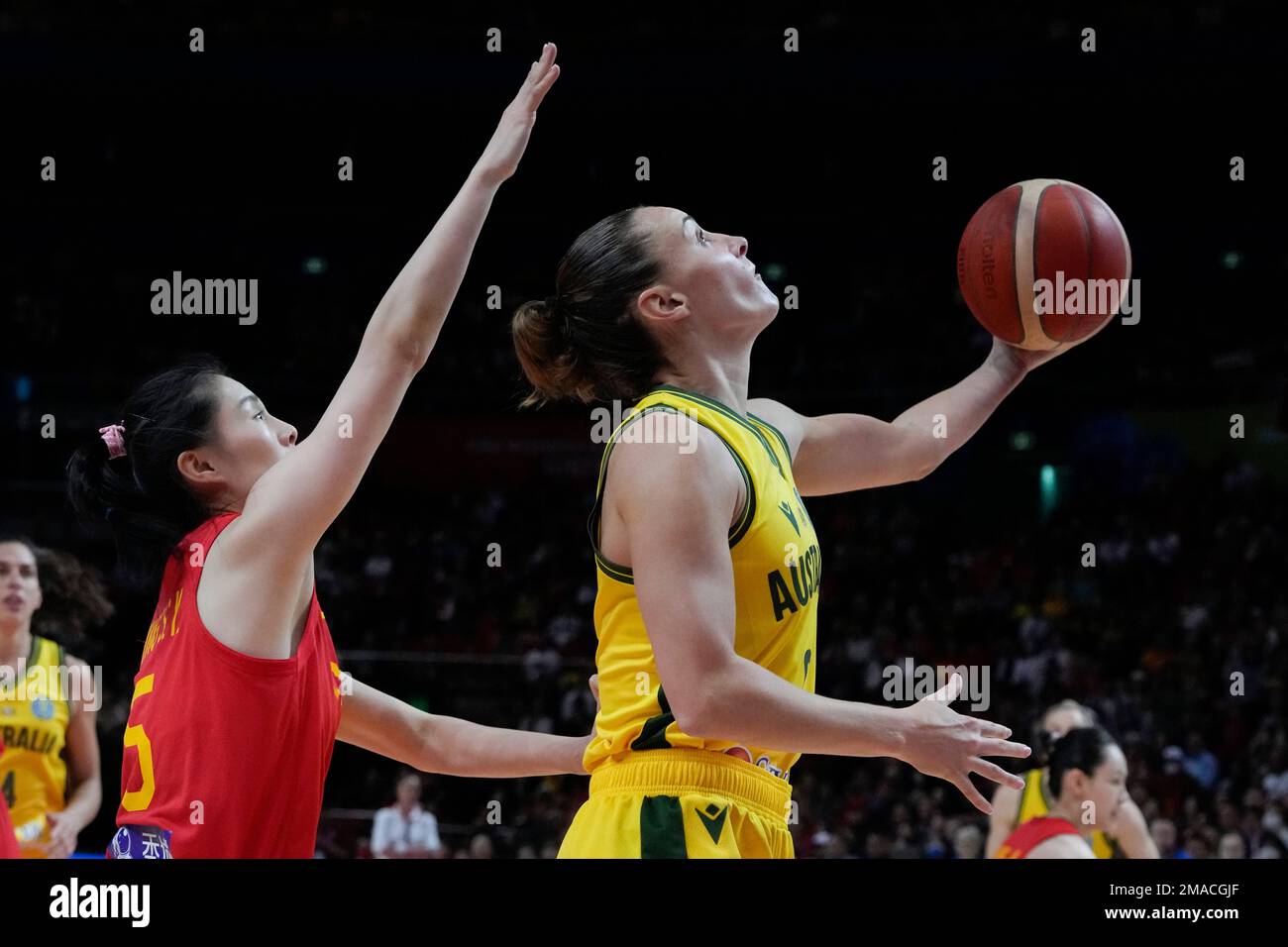 Australia's Steph Talbot, right, runs past China's Wang Siyu to shoot ...
