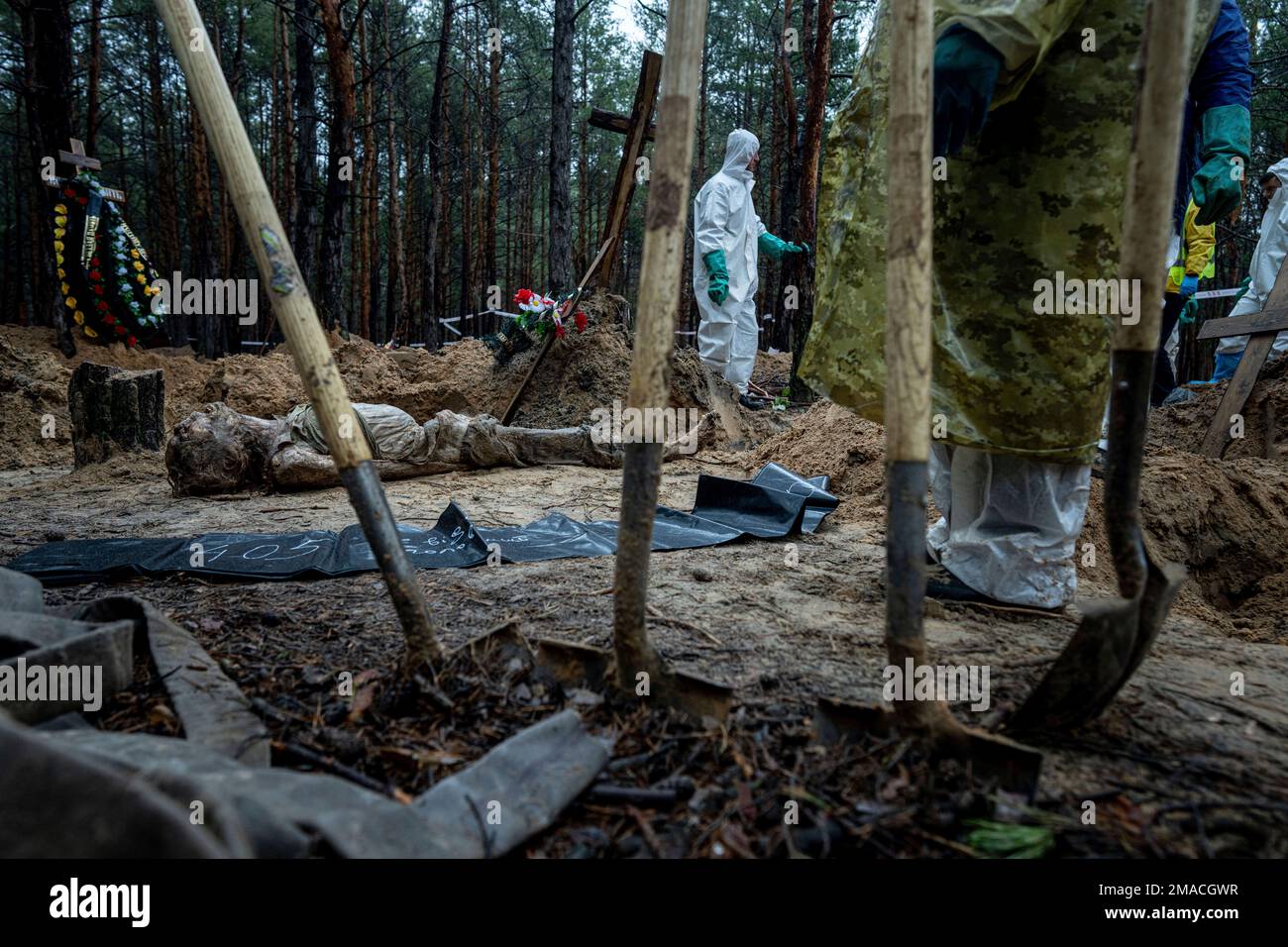 EDS NOTE: GRAPHIC CONTENT - The body of a civilian lies on the ground ...