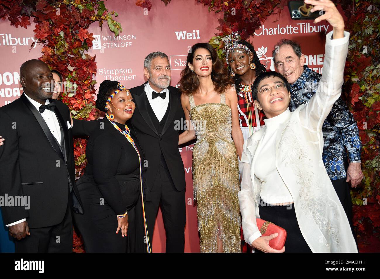 "Oumda" Alfateh Younous Haroun, left, Wanjiru Wahome, George Clooney ...