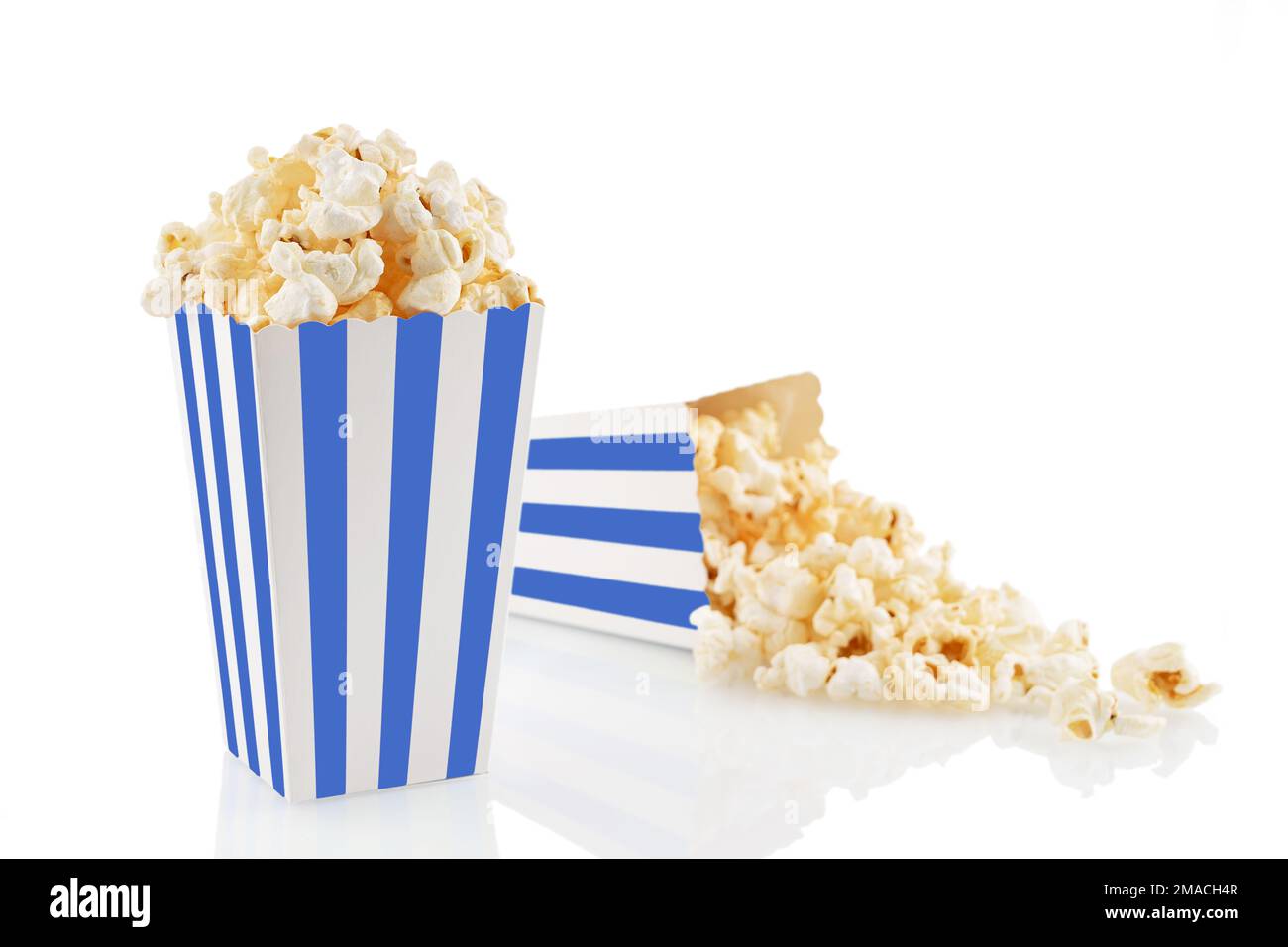 Two blue white striped carton buckets with tasty cheese popcorn ...
