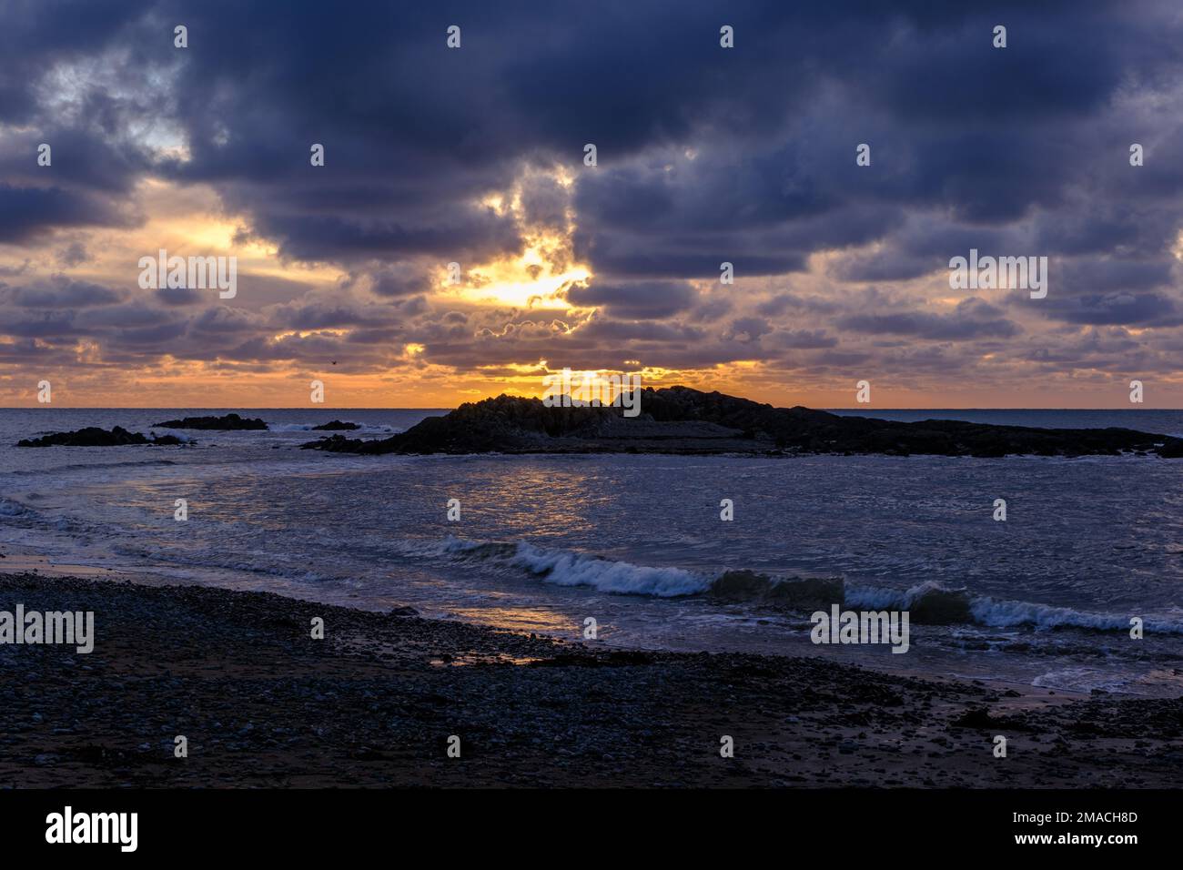 Dramatic coastal sunset at Rhosniegr on Anglesey, North Wales Stock ...