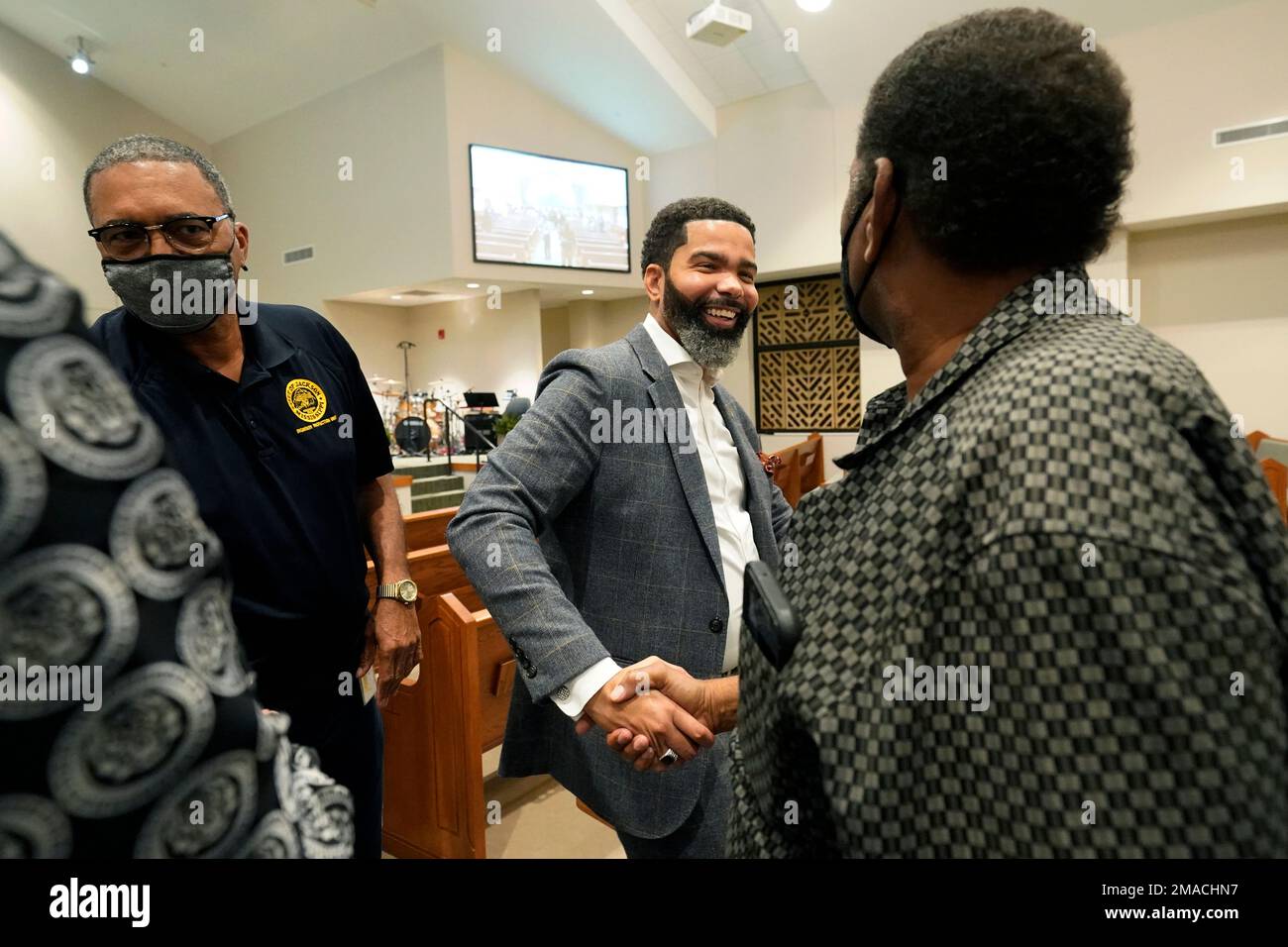 Jackson, Miss., Mayor Chokwe Antar Lumumba, center, greets a resident ...