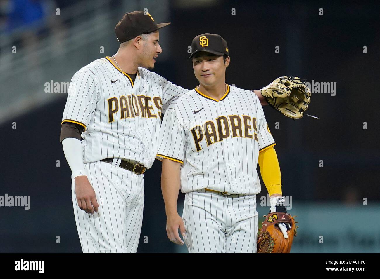 San Diego Padres third baseman Manny Machado, left, talks with ...
