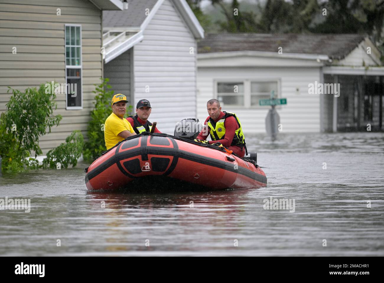 First responders with Orange County Fire Rescue use a boat to rescue a ...
