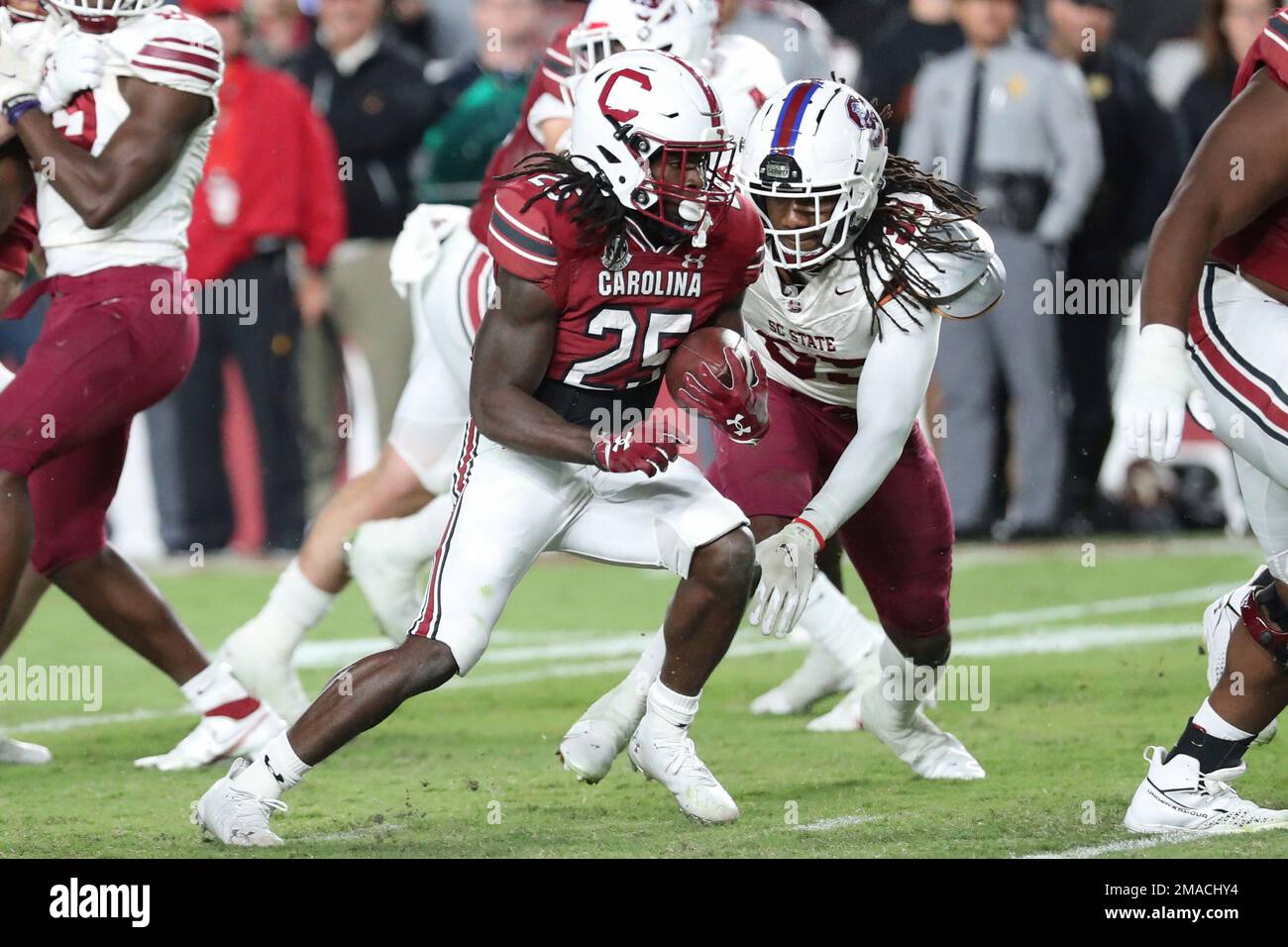 South Carolina running back Dante Miller (25) runs through an opening during the second half of ...