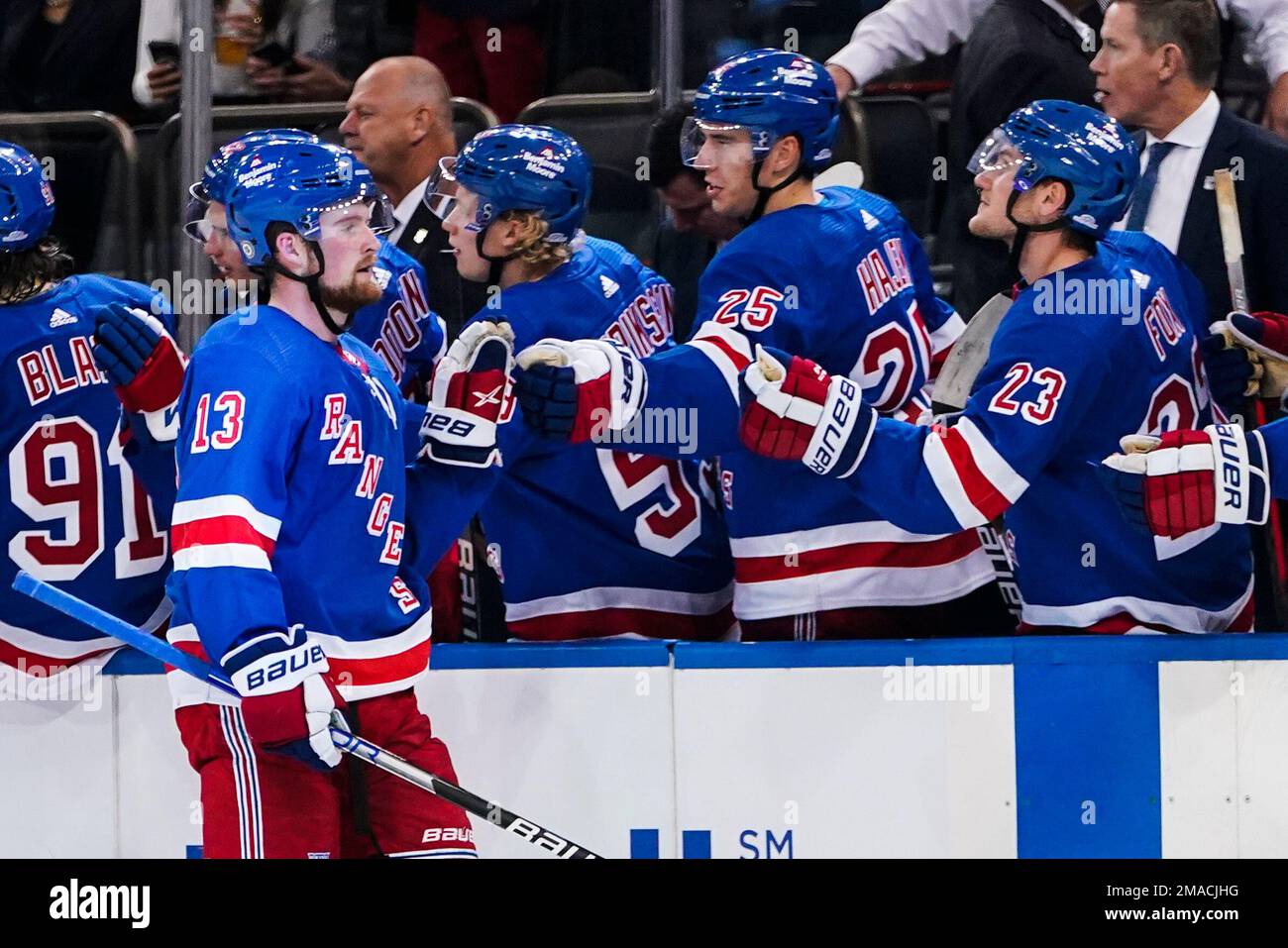 New York Rangers' Alexis Lafrenière (13) is congratulated after his ...
