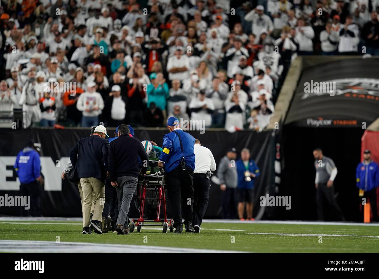 Miami Dolphins quarterback Tua Tagovailoa is taken off the field on a ...