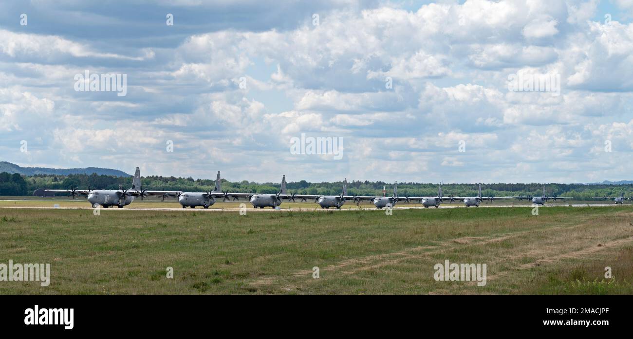 Several C-130 J Super Hercules aircraft line up on the flightline at ...