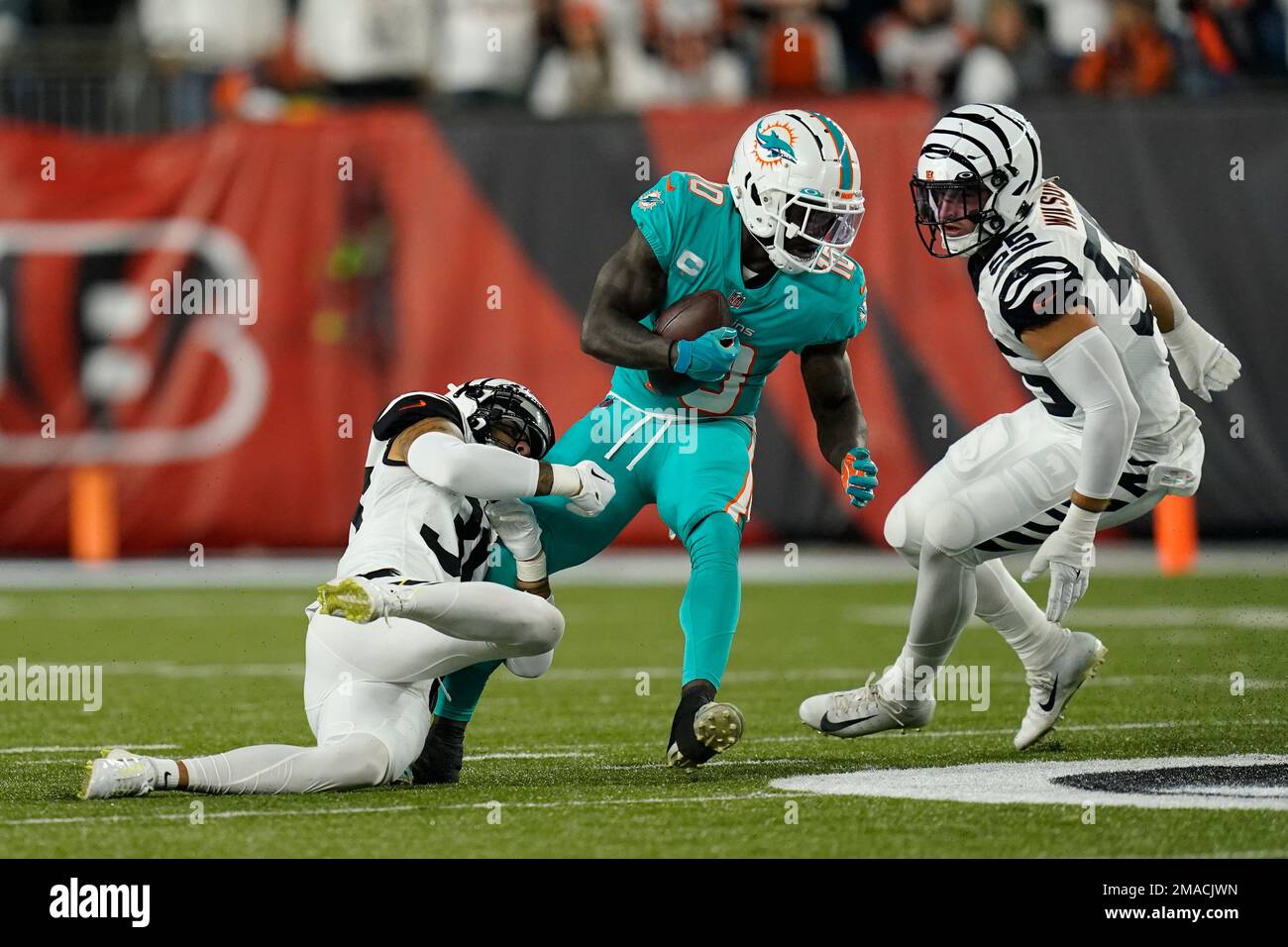 Miami Dolphins' Tyreek Hill (10) is tackled by dCincinnati Bengals ...
