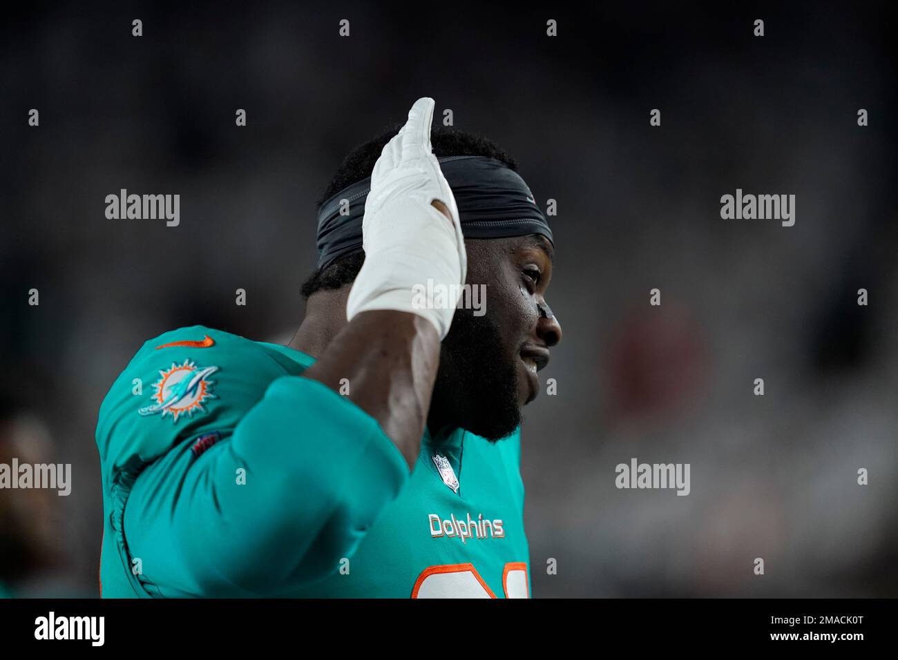Miami Dolphins' Emmanuel Ogbah walks off the field before an NFL ...