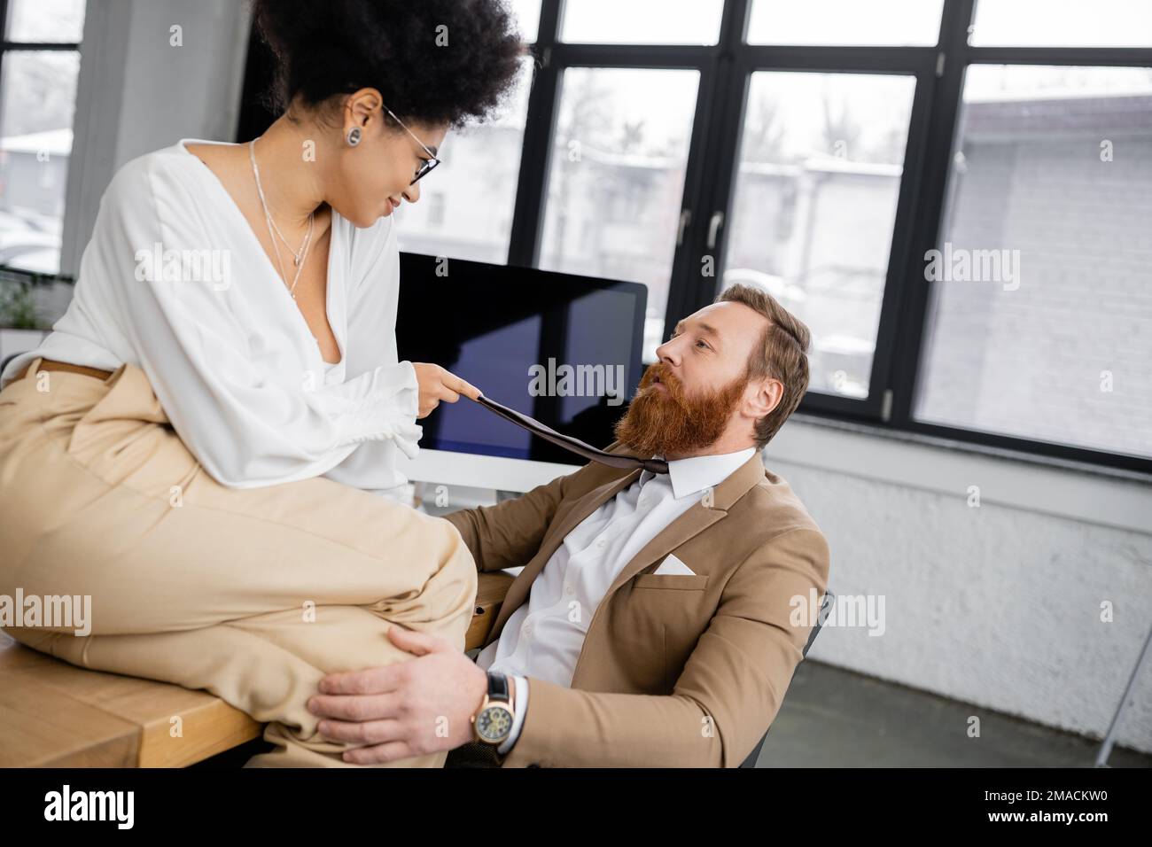 Smiling African American Woman In Glasses Pulling Tie While Seducing