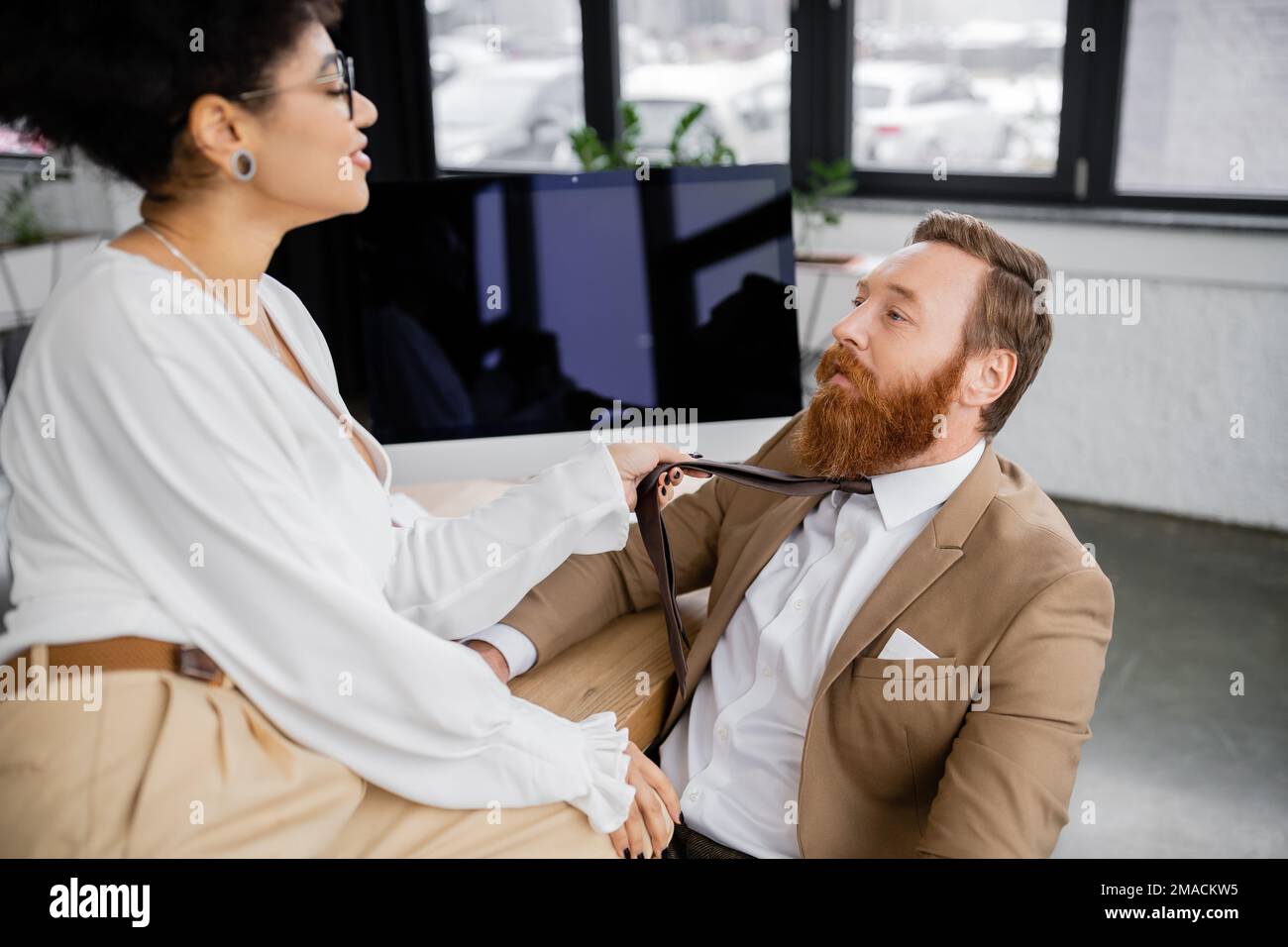 Cheerful African American Woman In Glasses Pulling Tie While Seducing