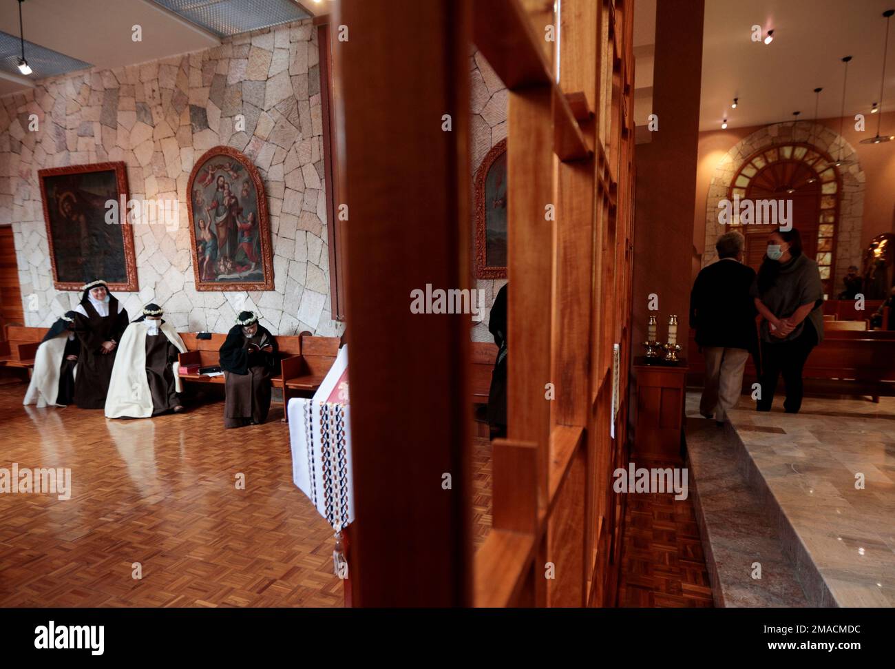 Carmelite nuns listen to a Mass at the church of Our Lady of Soledad ...