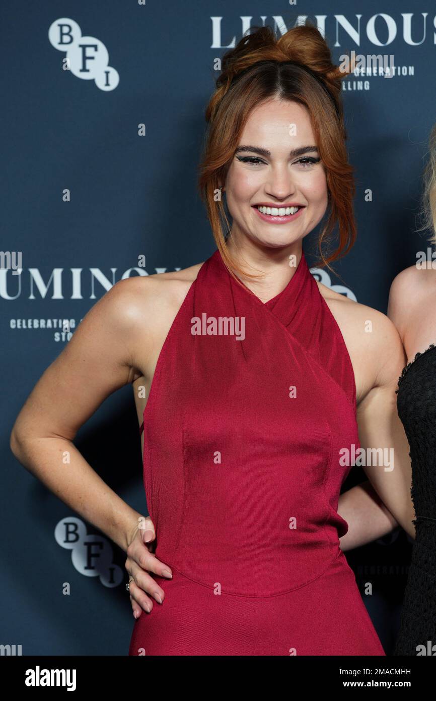 Lily James poses for photographers on arrival at the 'BFI Luminous ...