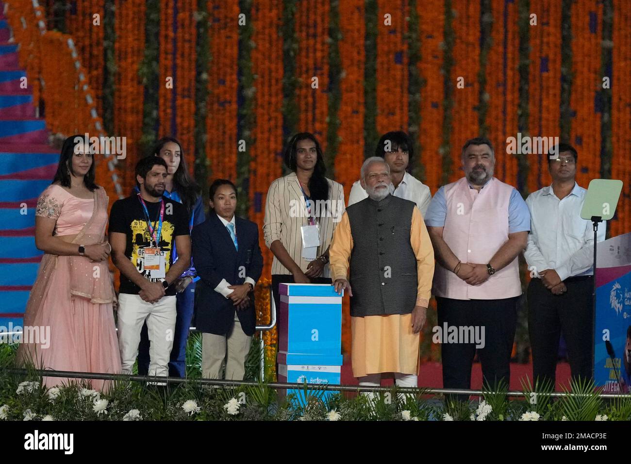 Indian Prime Minister Narendra Modi stands with sports personalities ...