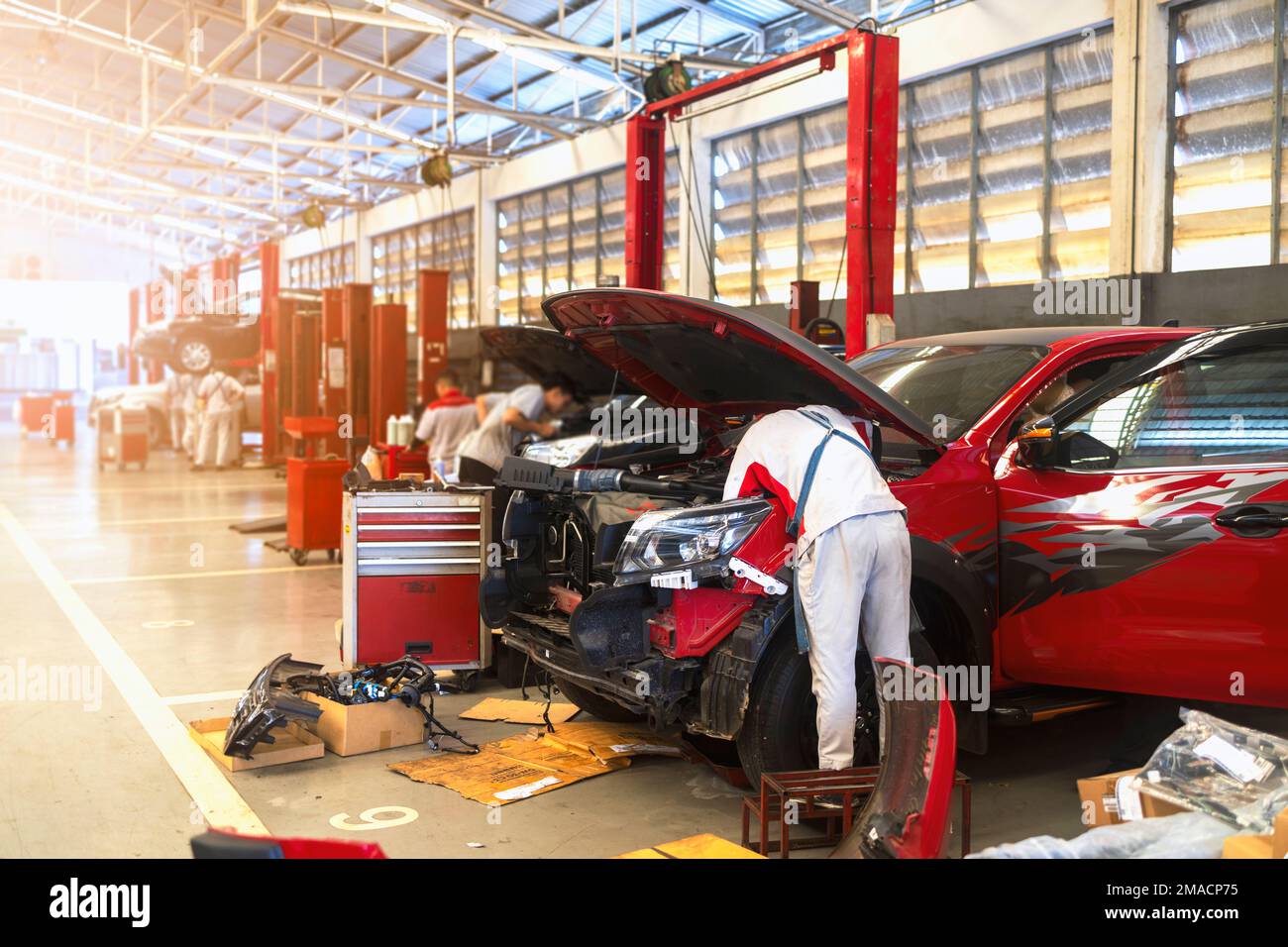 car in automobile repair service center with soft-focus and over light ...