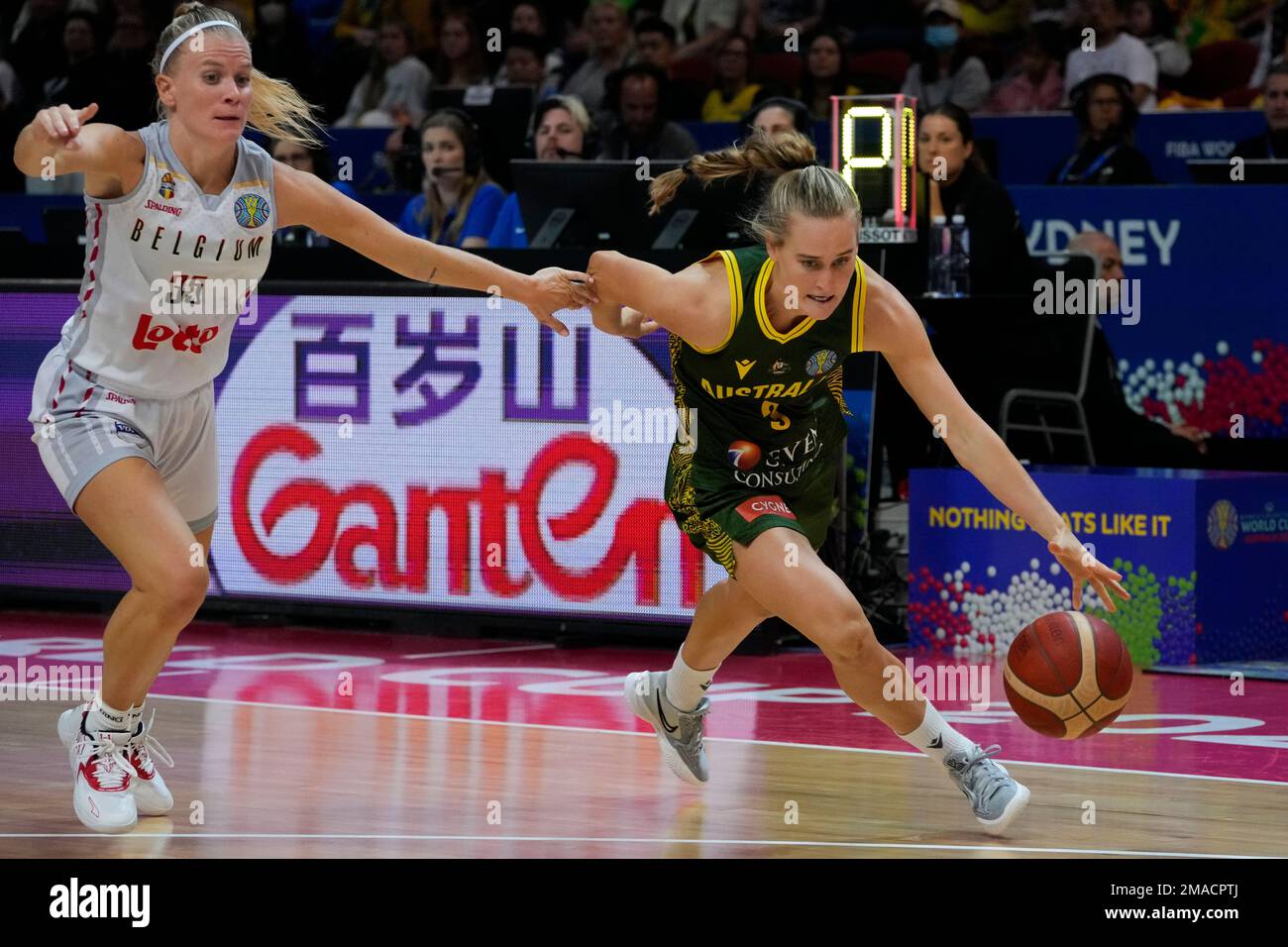 Australia's Kristy Wallace, right, runs past Belgium's Julie Vanloo ...
