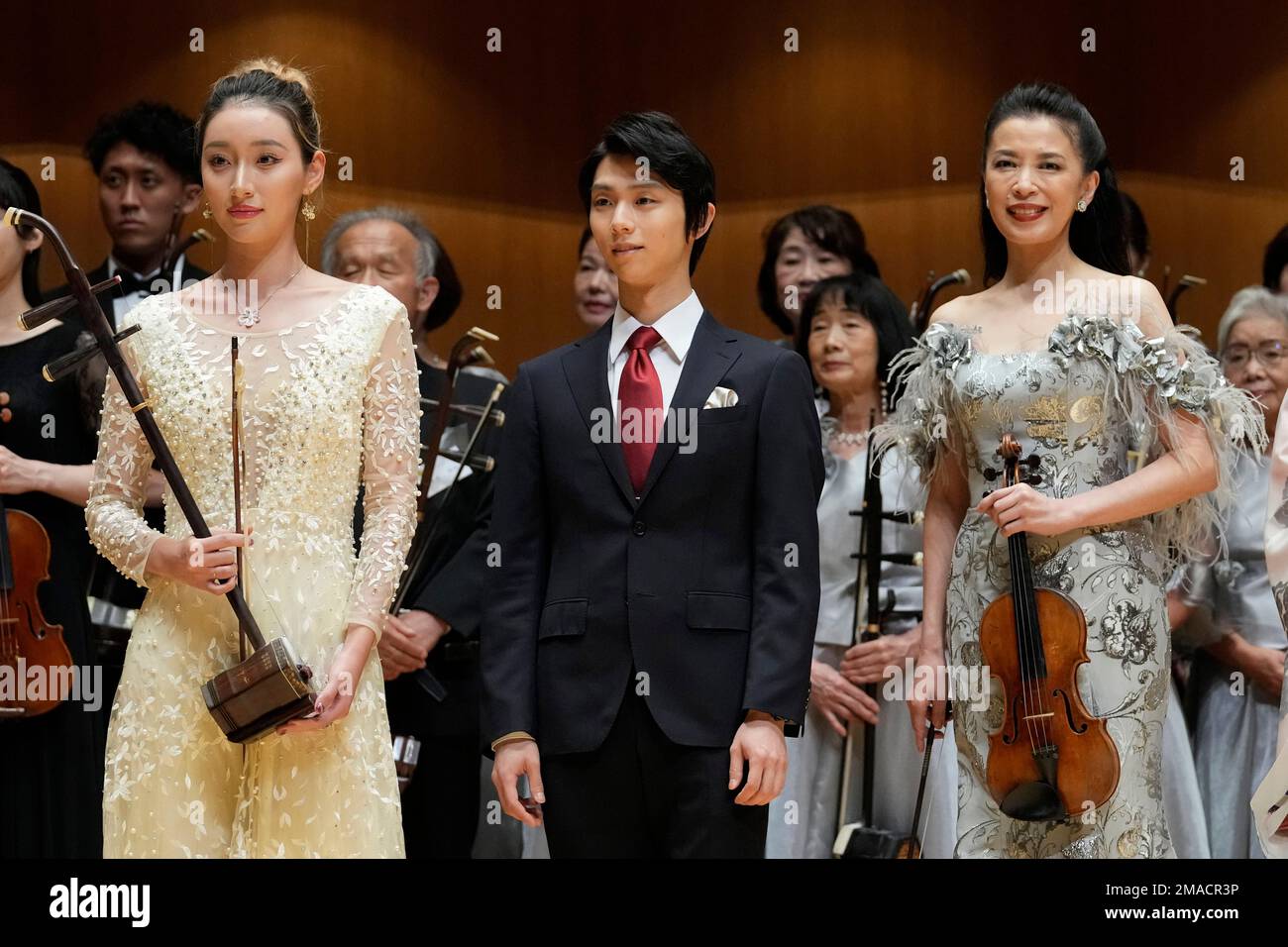 Chinese Japanese Erhu player Zhang Hina, from left, Japanese figure skater Yuzuru Hanyu and ...