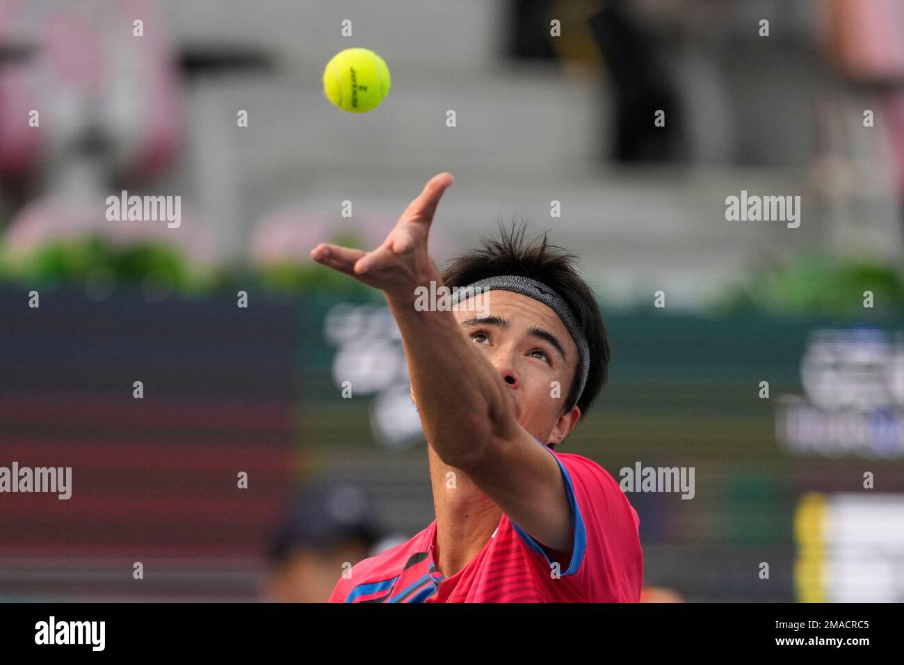 Taro Daniel of Japan serves to Yoshihito Nishioka of Japan during the ...