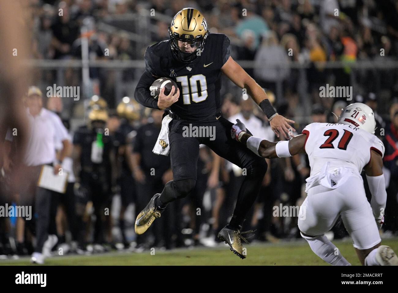 Central Florida quarterback John Rhys Plumlee (10) eludes Louisville ...