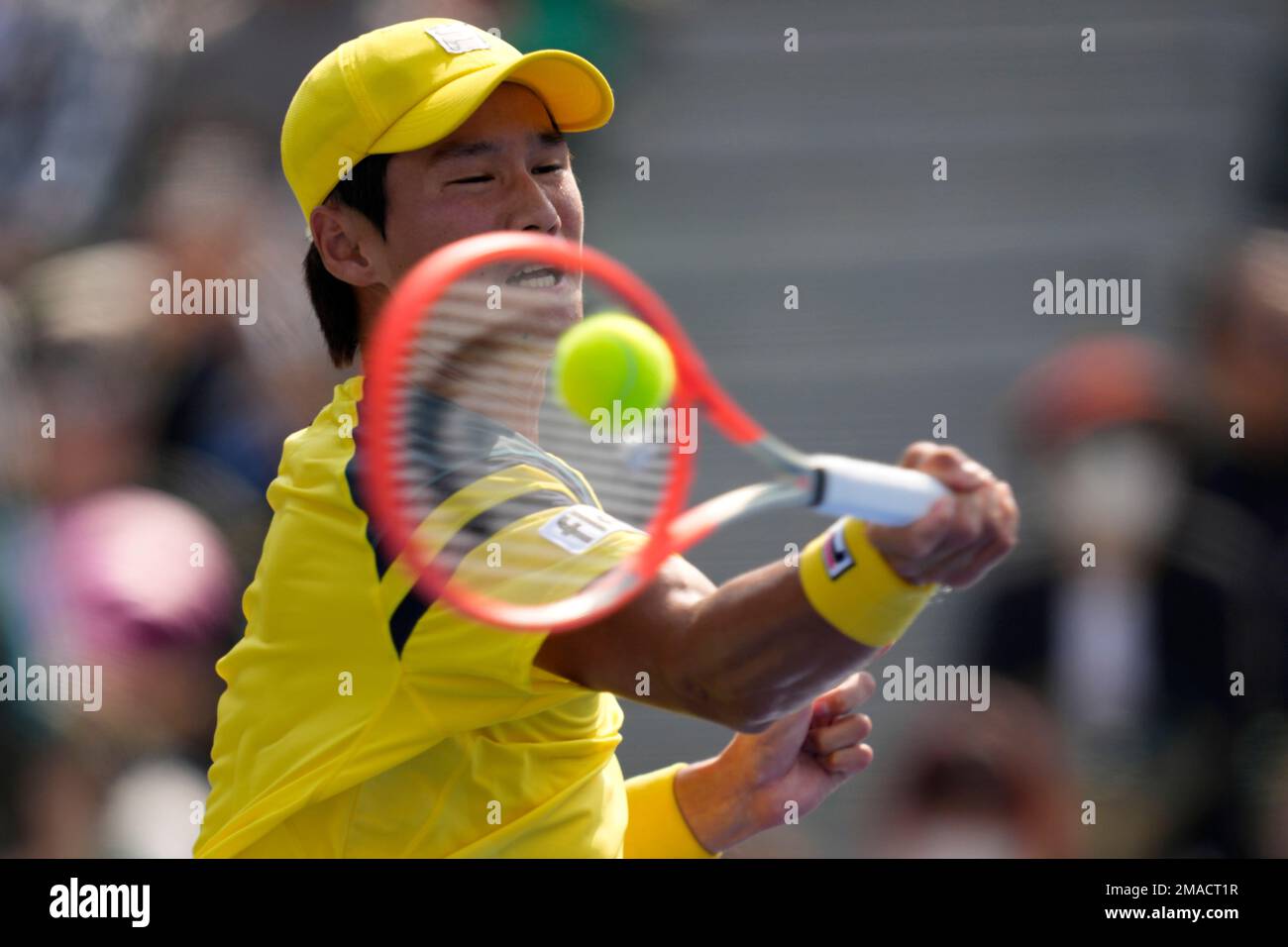 Kwon Soon-woo of South Korea returns a shot to Jenson Brooksby, of the ...