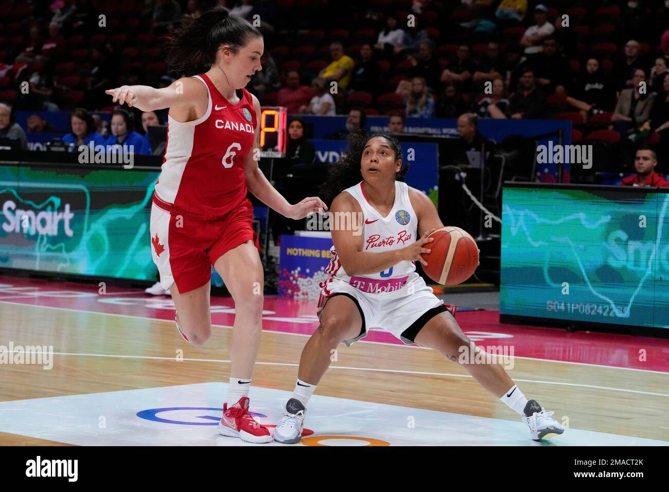 Puerto Rico's Jennifer O'Neill, right, looks to get past Canada's ...