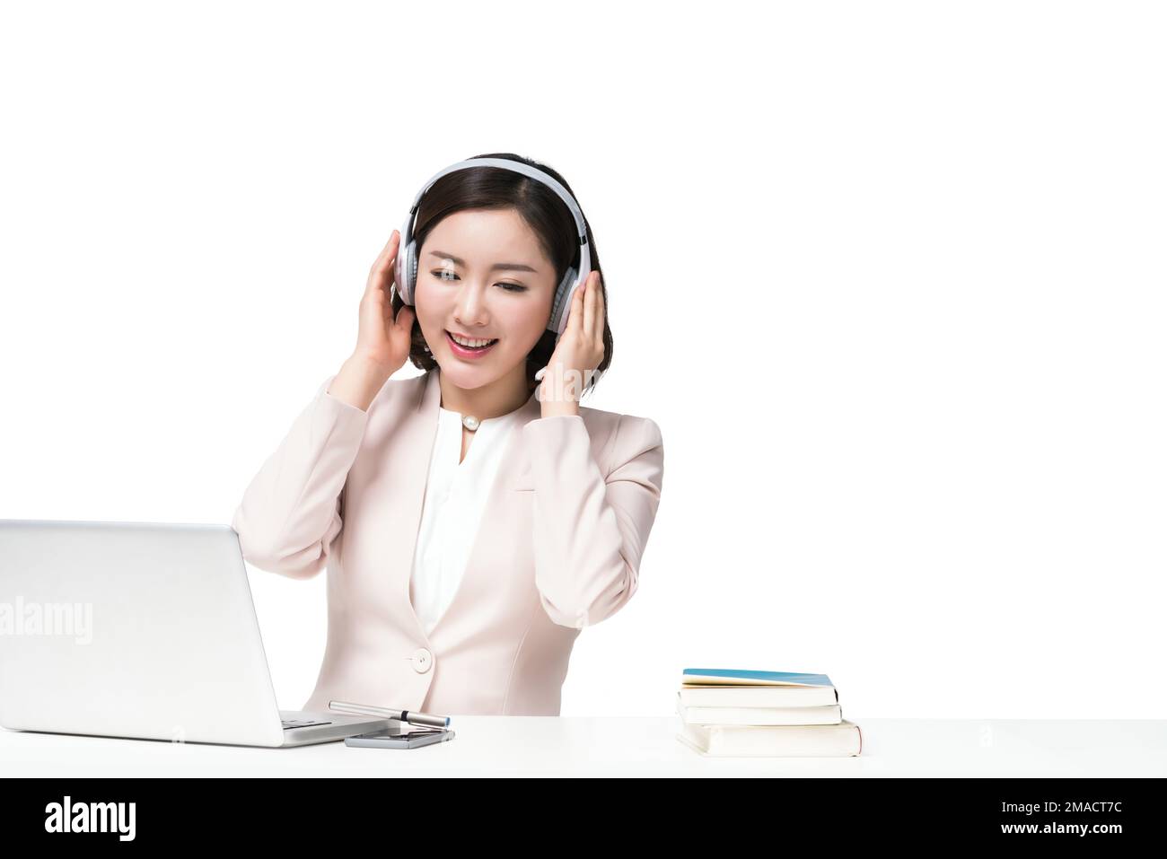 Young woman wearing a headset to use a computer Stock Photo - Alamy