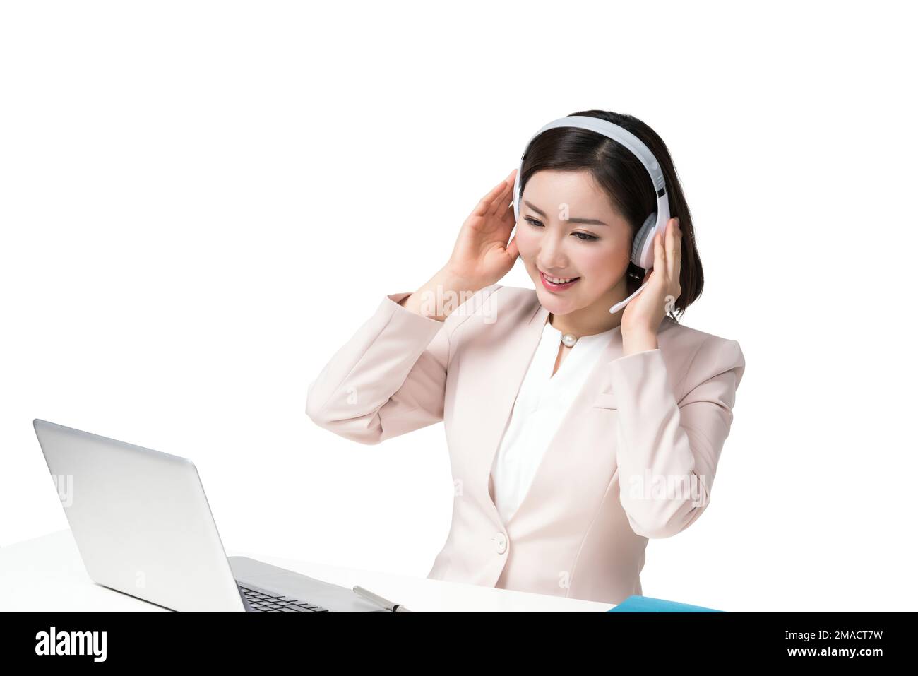 Young woman wearing a headset to use a computer Stock Photo - Alamy