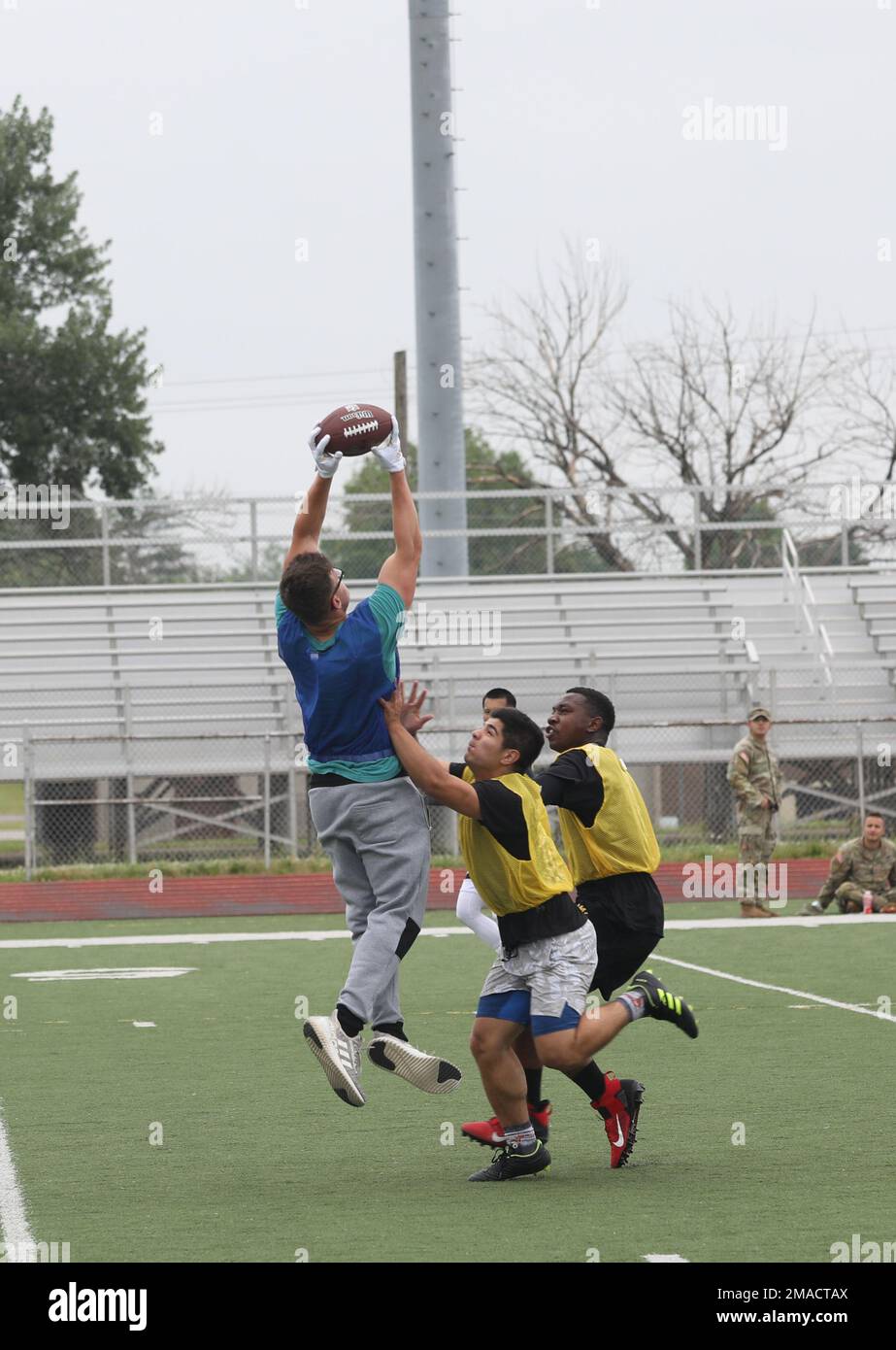 A Soldier from the 1st Brigade Combat Team makes a catch over two ...