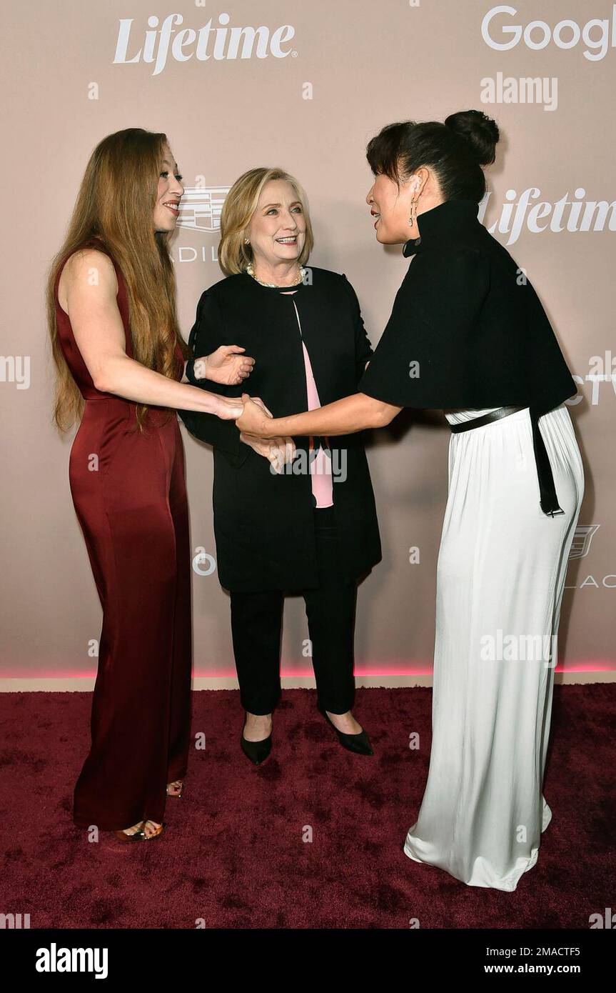 Chelsea Clinton, from left, Hillary Clinton and Sandra Oh arrive at ...