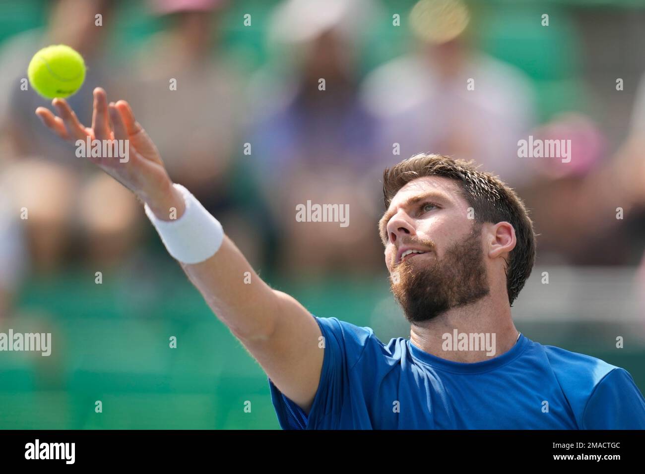 Cameron Norrie, of Britain, serves to Kaichi Uchida of Japan during the ...