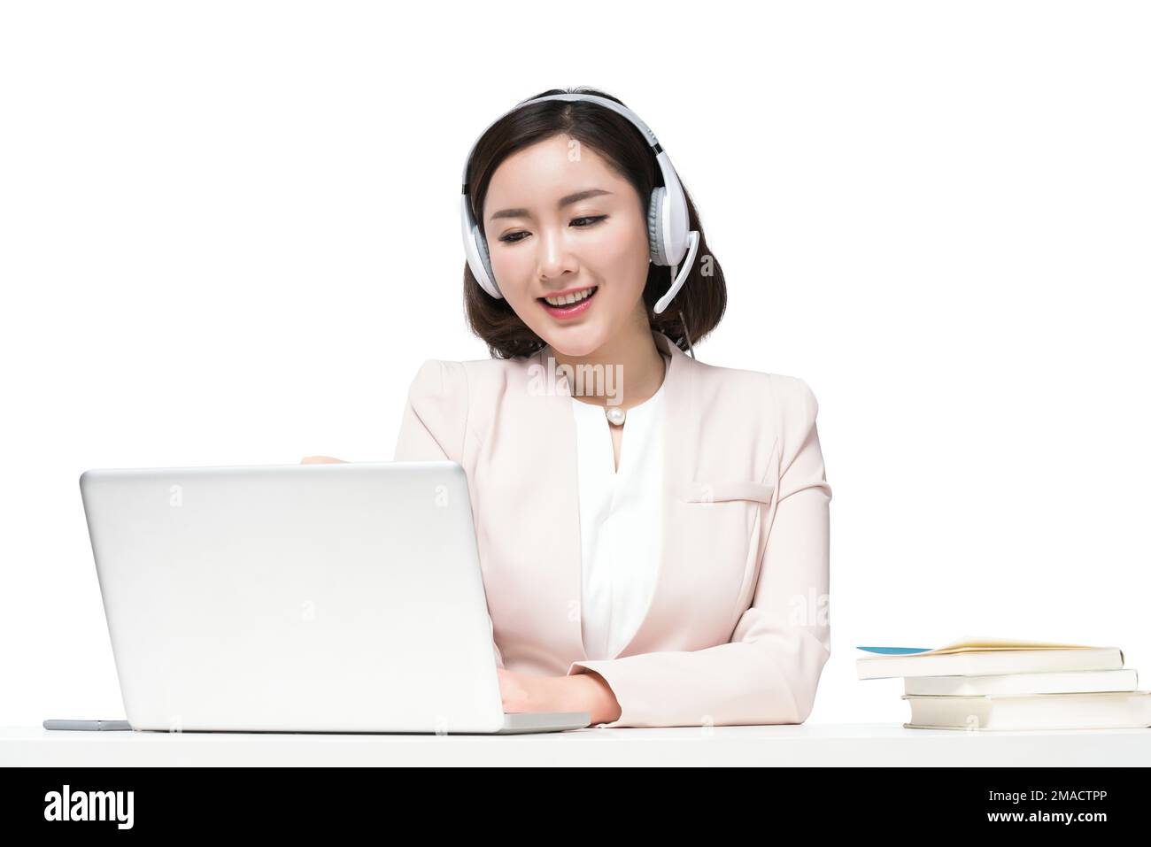 Young woman wearing a headset to use a computer Stock Photo - Alamy