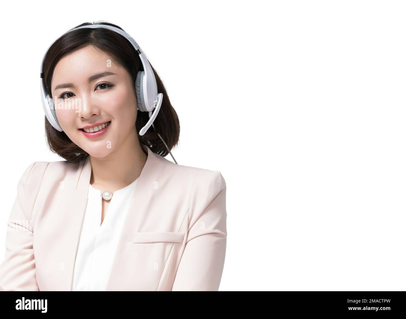 Young woman wearing a headset to use a computer Stock Photo - Alamy