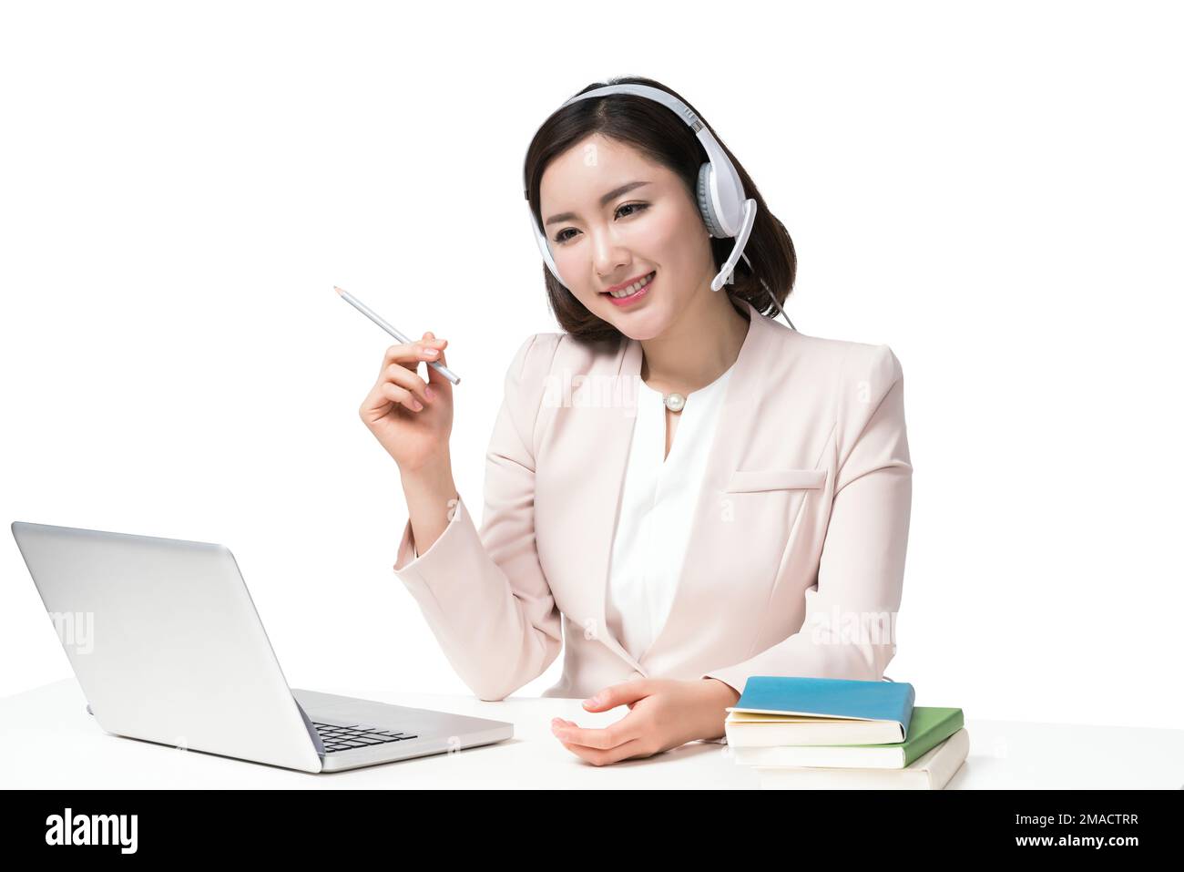 Young woman wearing a headset to use a computer Stock Photo - Alamy