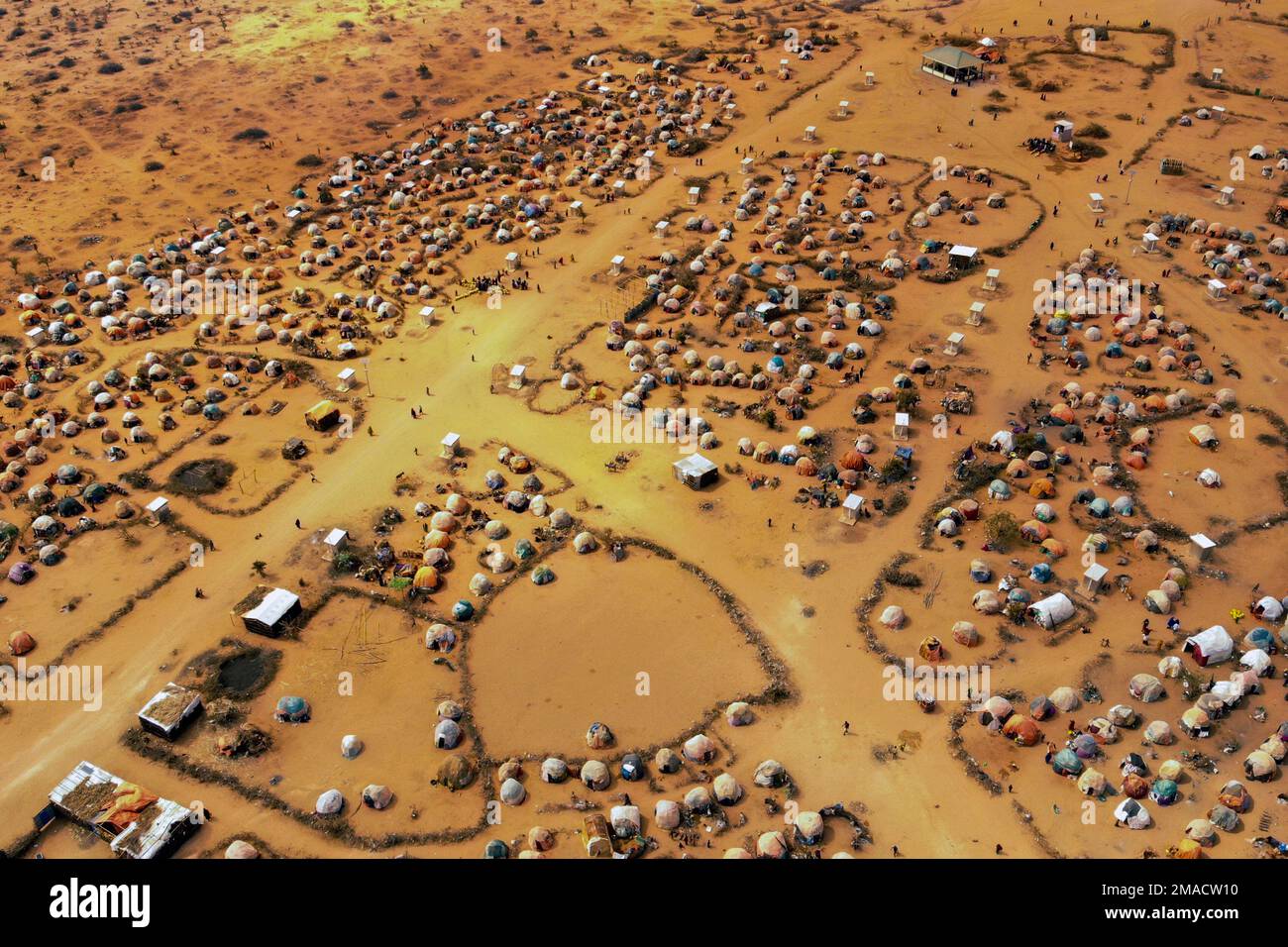 Huts made of branches and cloth provide shelter to Somalis displaced by ...