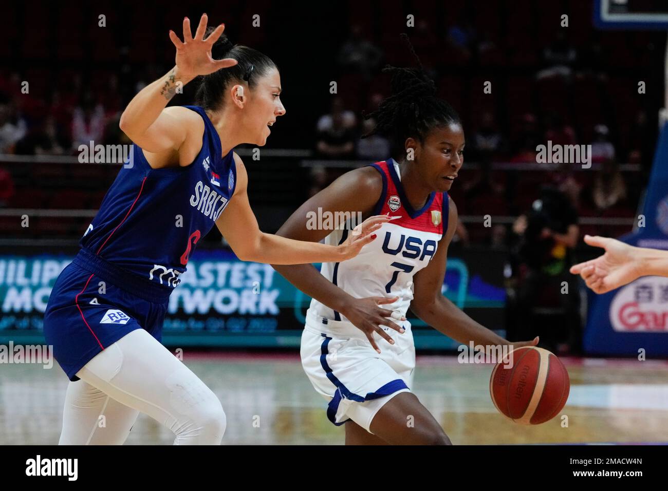United States' Ariel Atkins runs past Serbia's Sasa Cado during their ...
