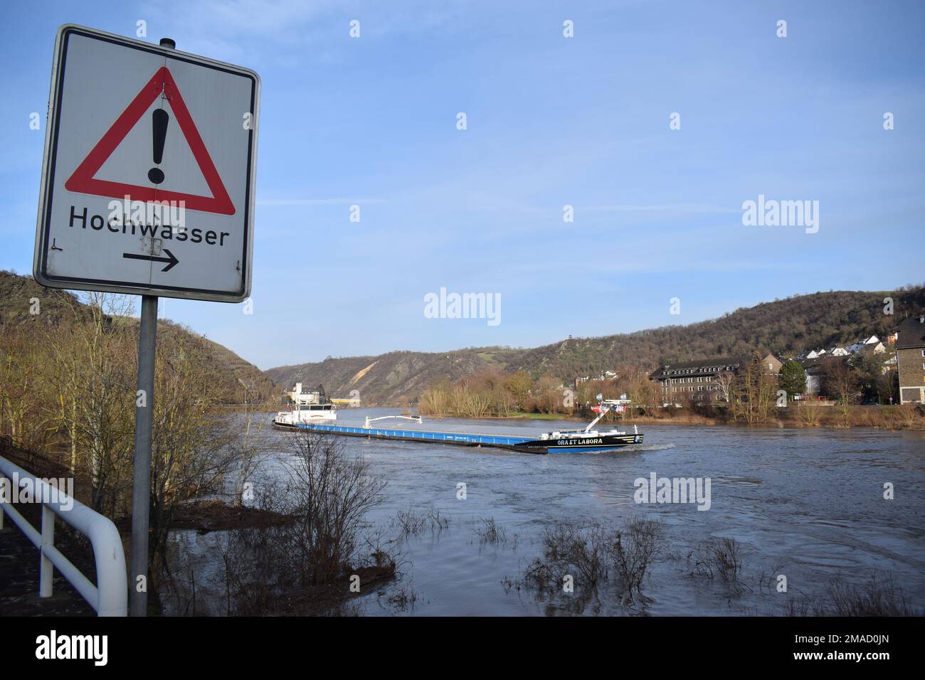 cargo ship next to a flood warning sign Stock Photo - Alamy