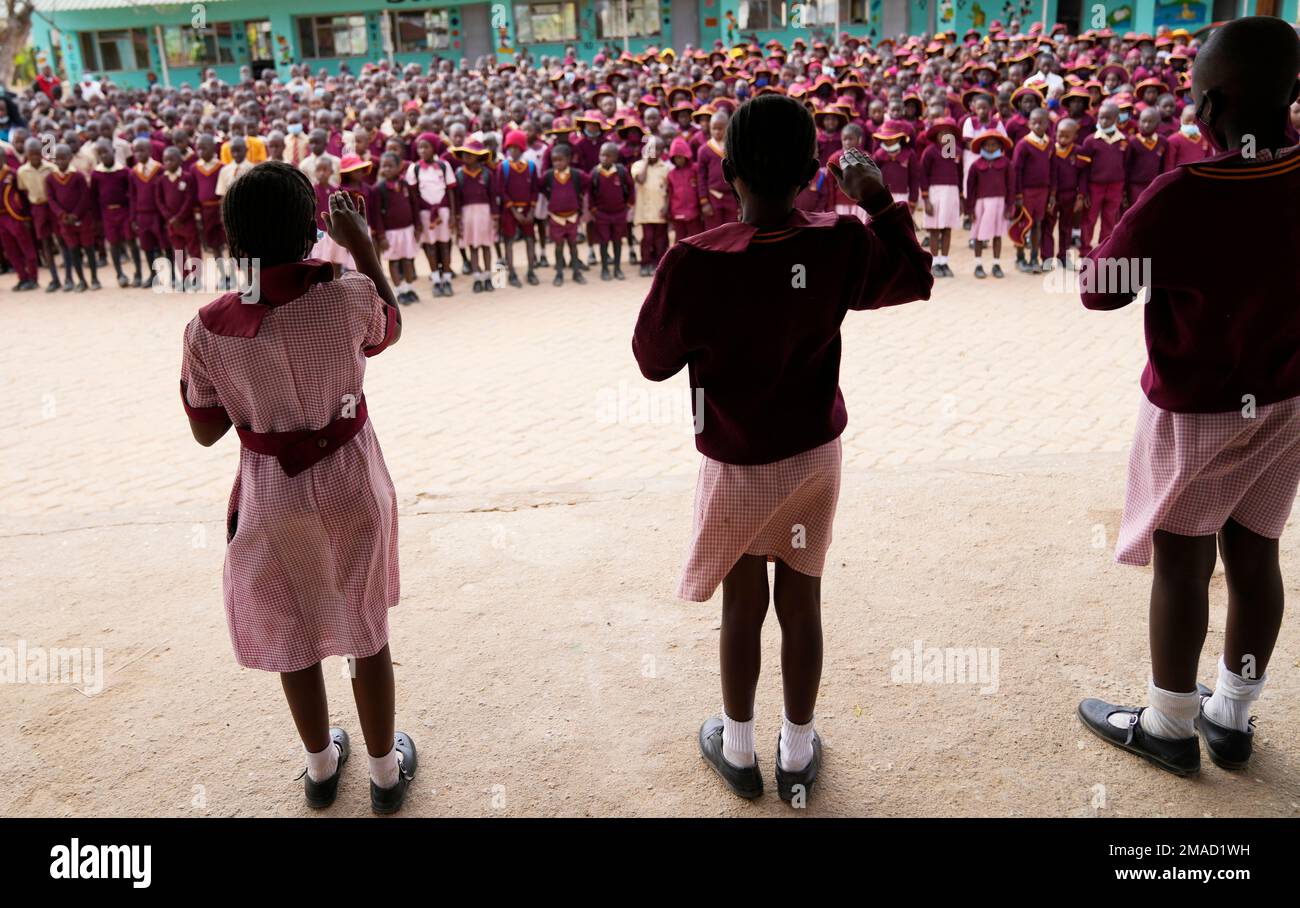 Schoolchildren sing the Zimbabwe National Anthem in Sign Language at a ...