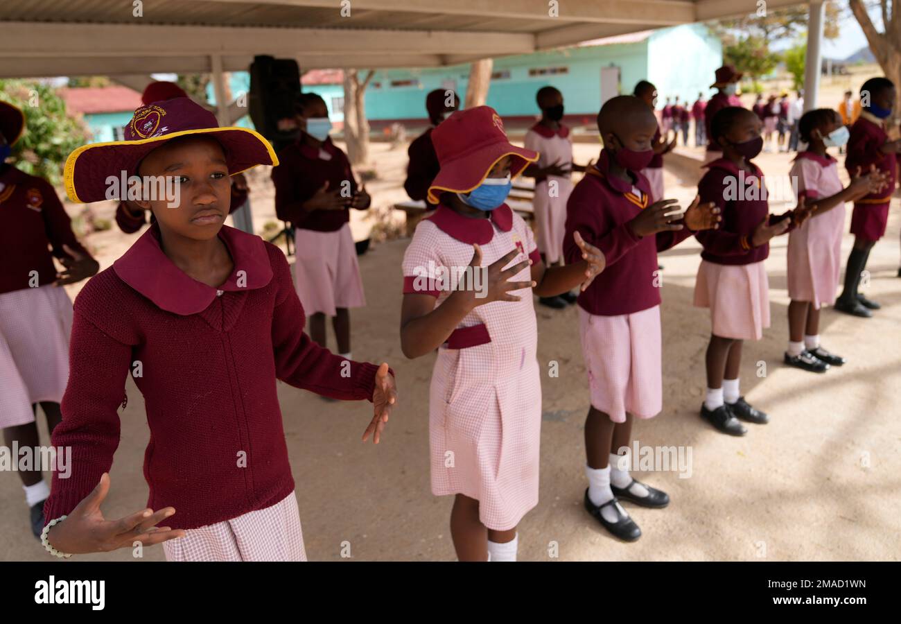 Schoolchildren sing the Zimbabwe National Anthem in Sign Language at a ...