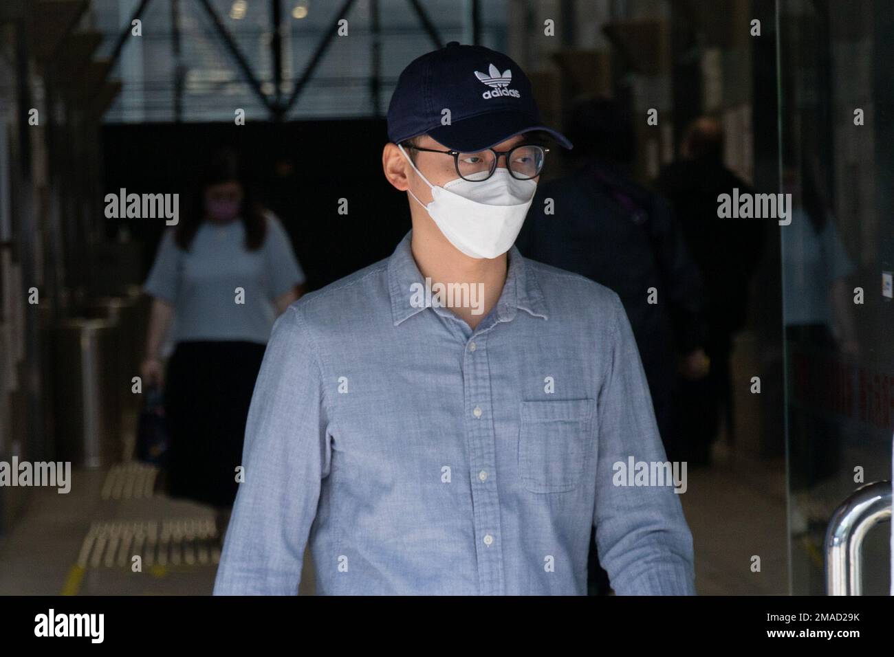 Former activist Alvin Cheng Kam-mun leaves the District Court in ...