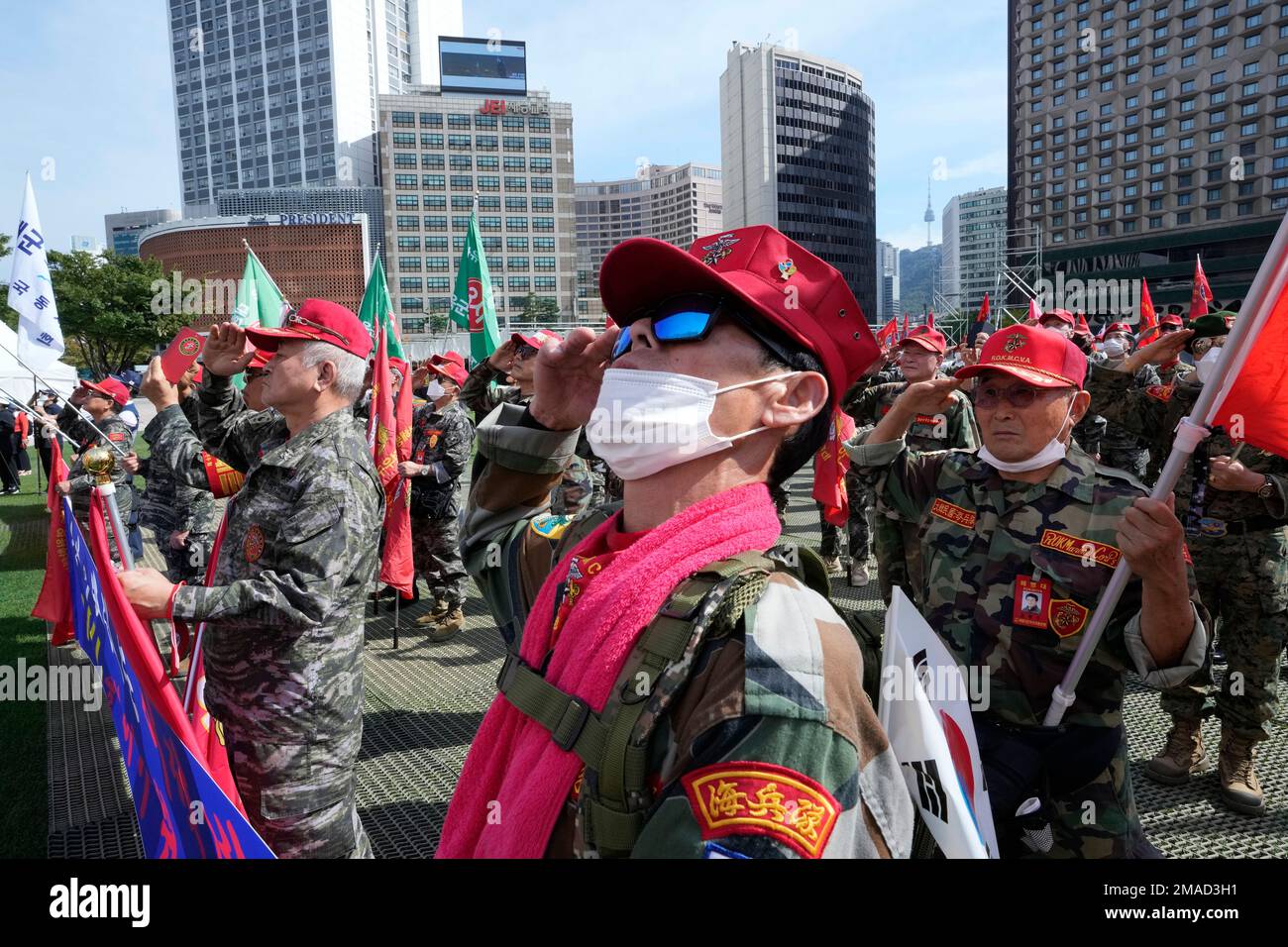 Marine veterans salute during the ceremony of the 72st anniversary of ...