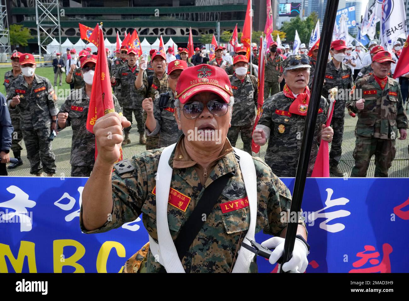Marine veterans sing a military song during the ceremony of the 72st ...