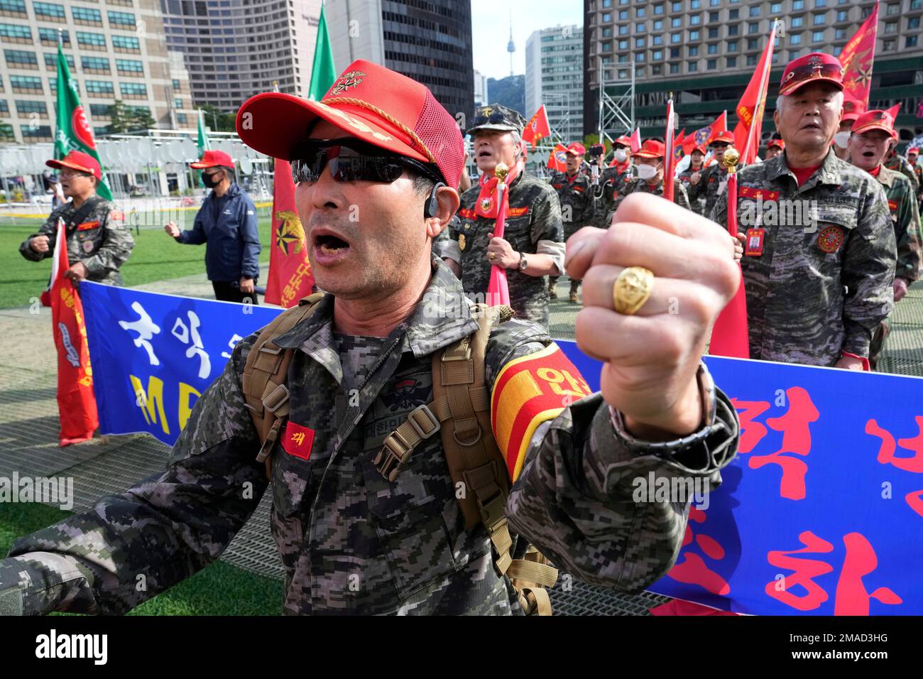 A marine veteran sings a military song during the ceremony of the 72st ...