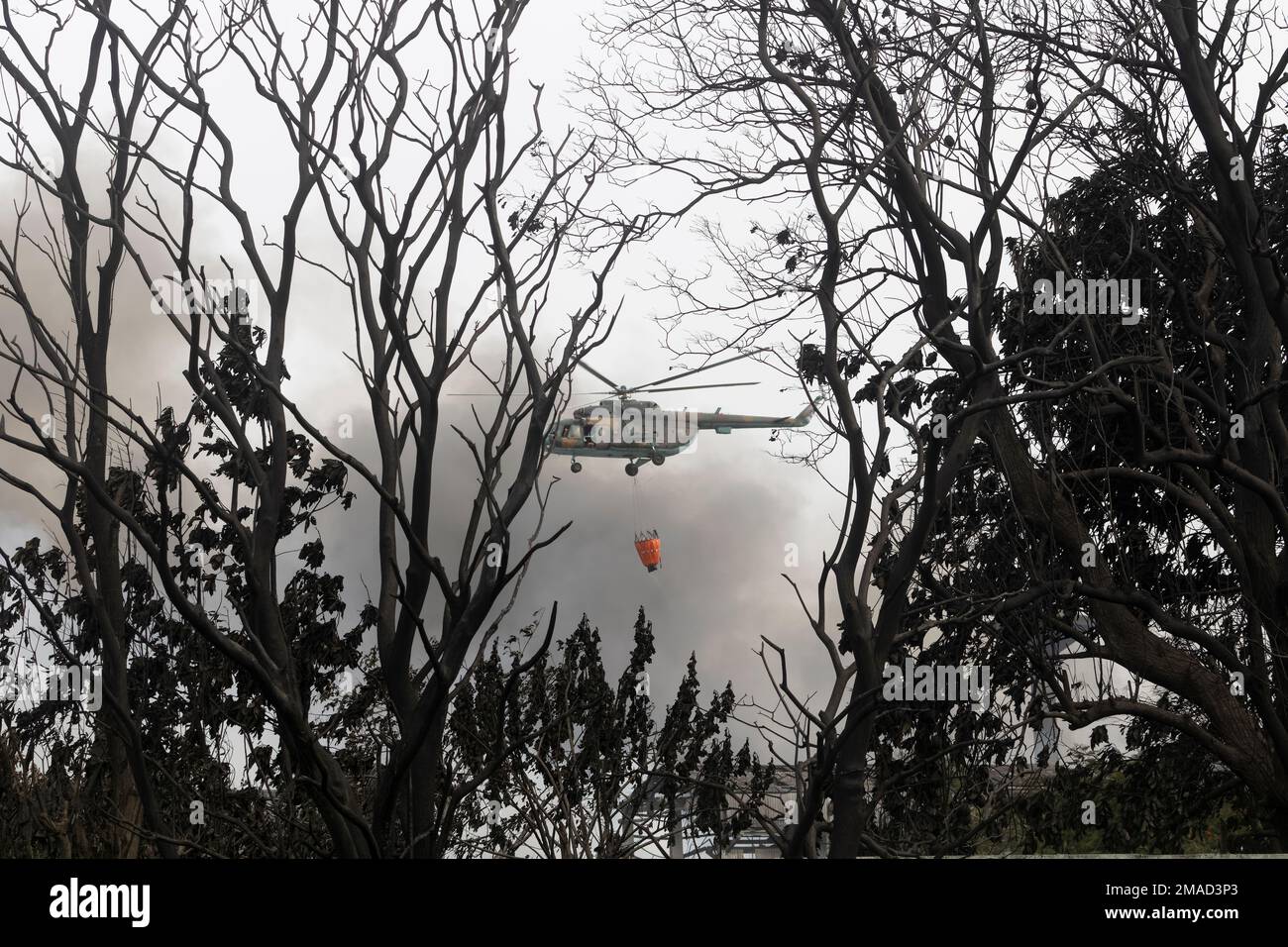 The Cuban armed forces helicopter putting out the fire from the ...
