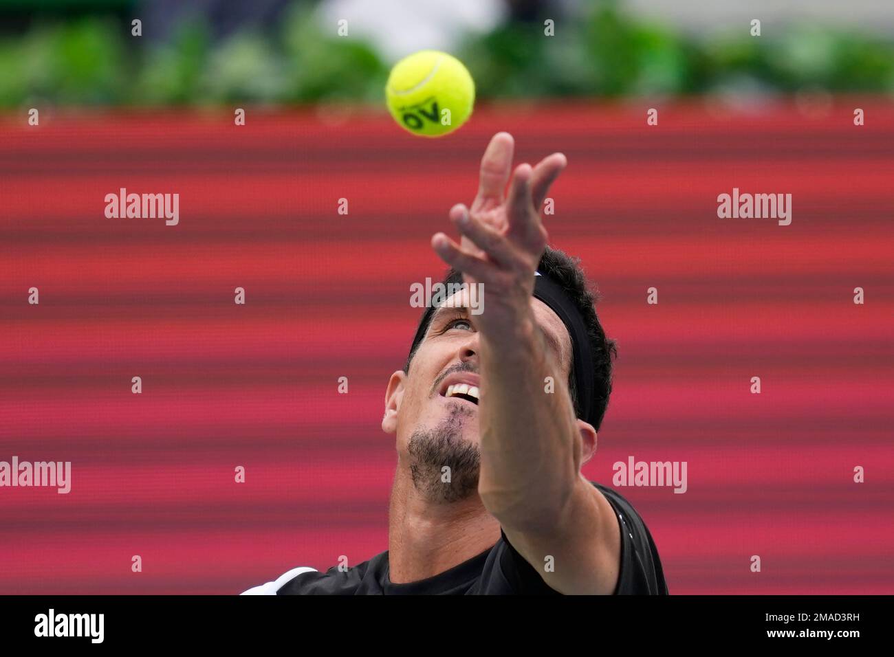 Ecuador's Emilio Gomez serves to Japan's Taro Daniel during the Korea ...