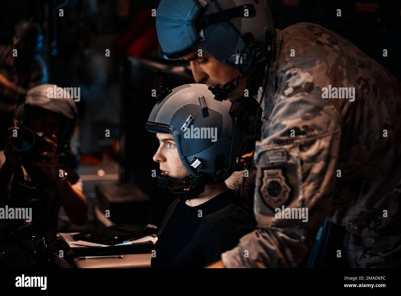 Sam Eckholm, multimedia content creator, learns how to operate the ...